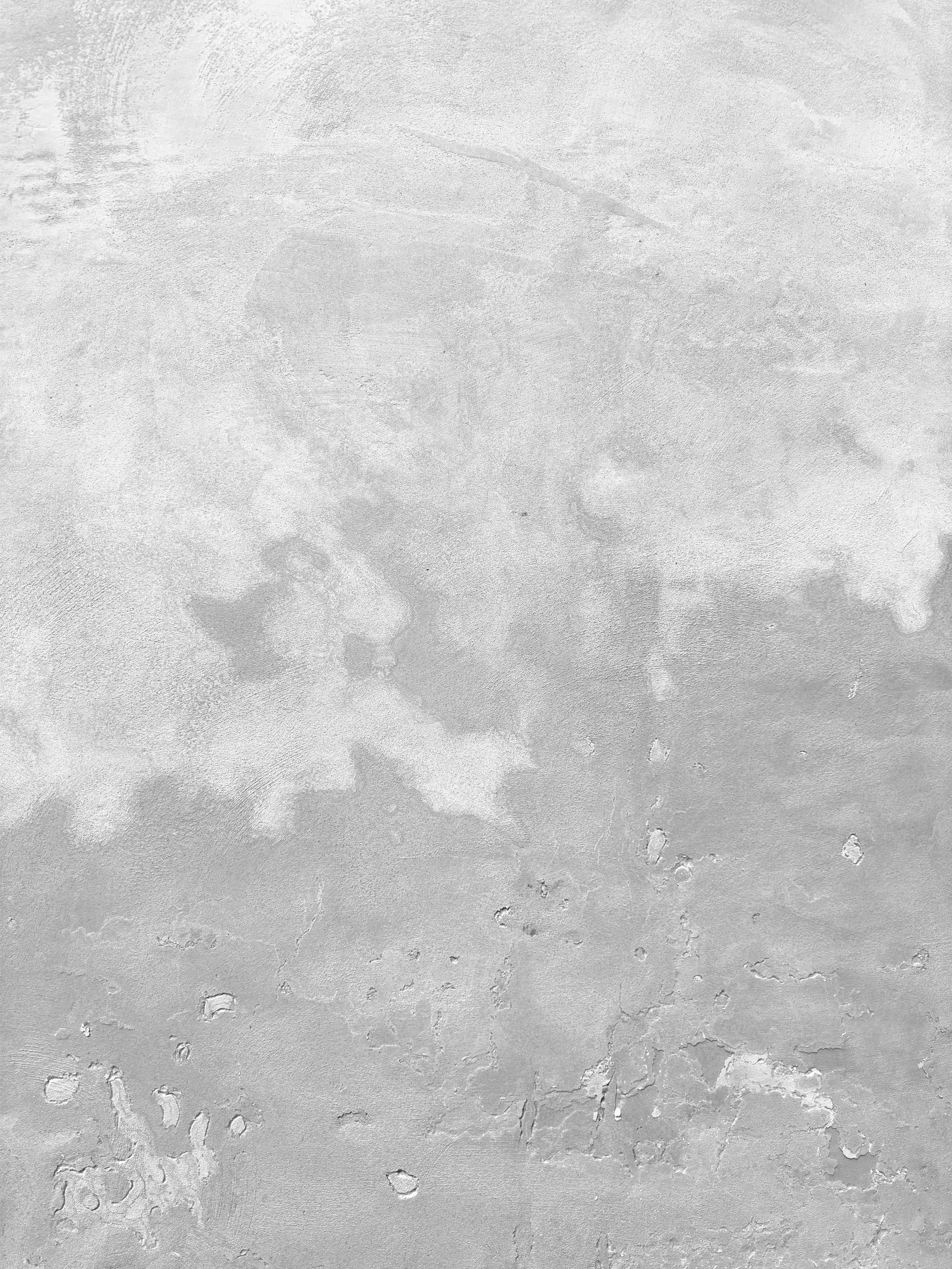 Abstract gray surface with subtle textures and patterns, evoking a sense of calm and simplicity.