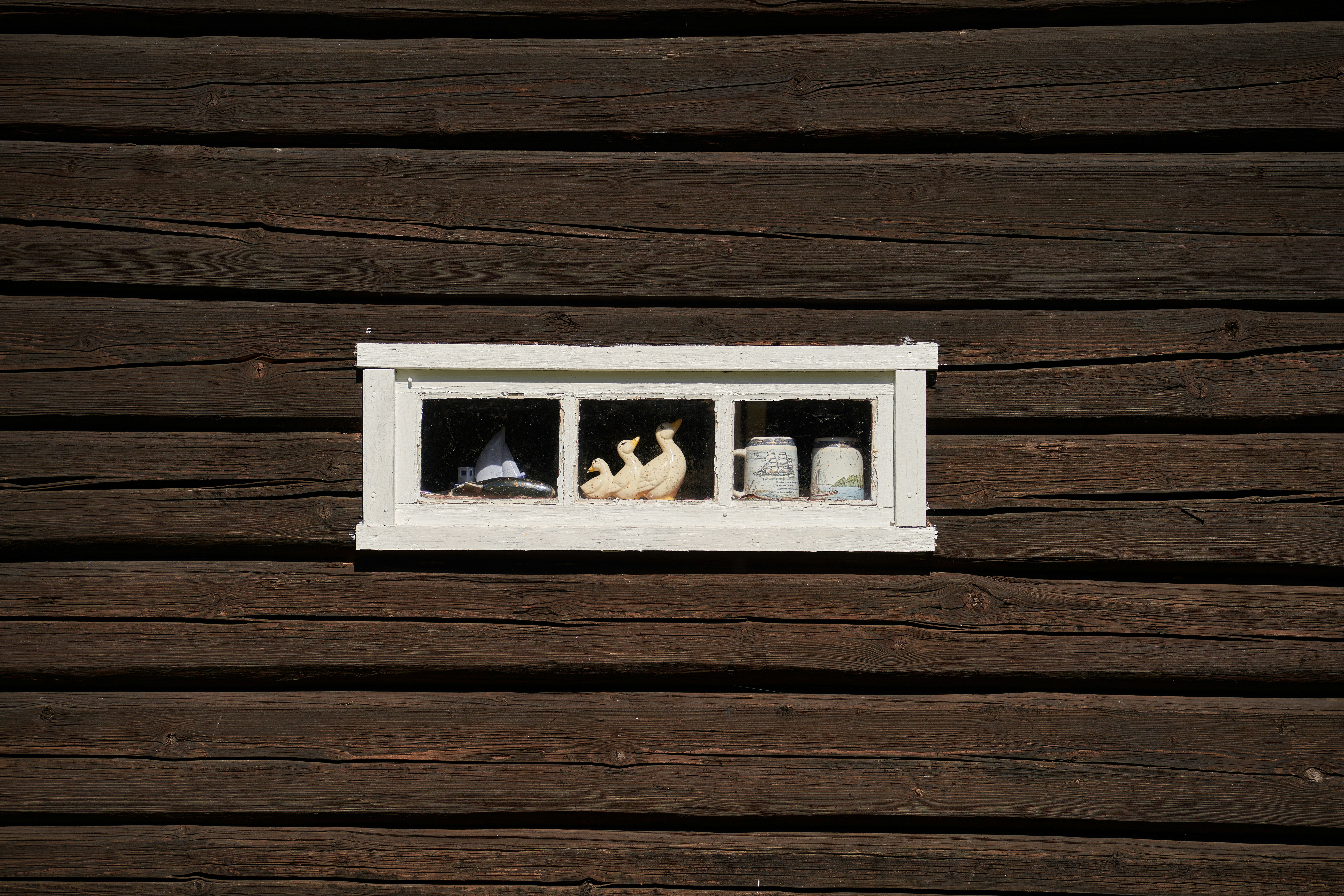 Snowy Windowled Shelf: A Quiet Still Life in Wood Plank Wall
