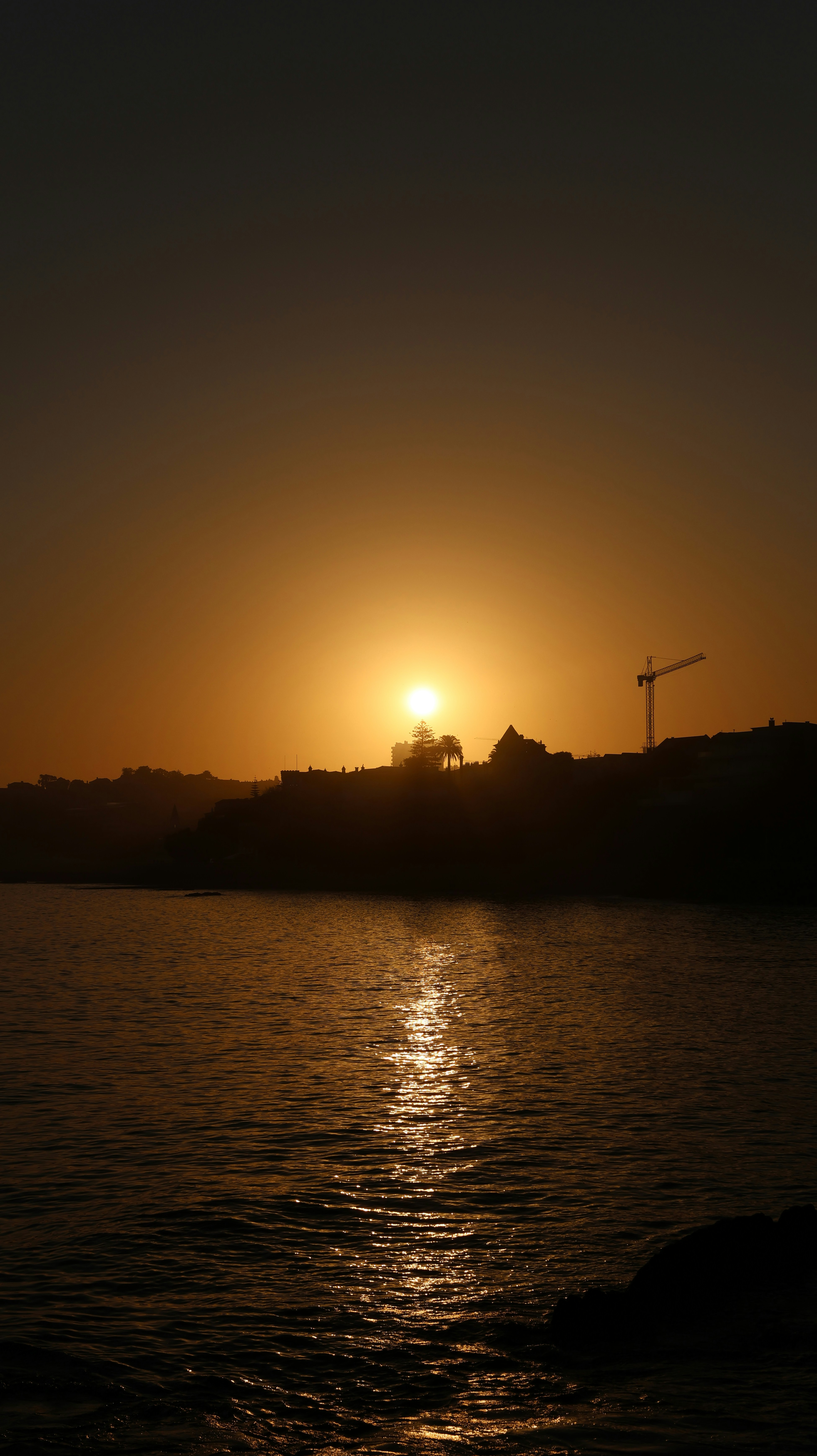 The sun is setting over a body of water photo – Free Sun set Image on ...