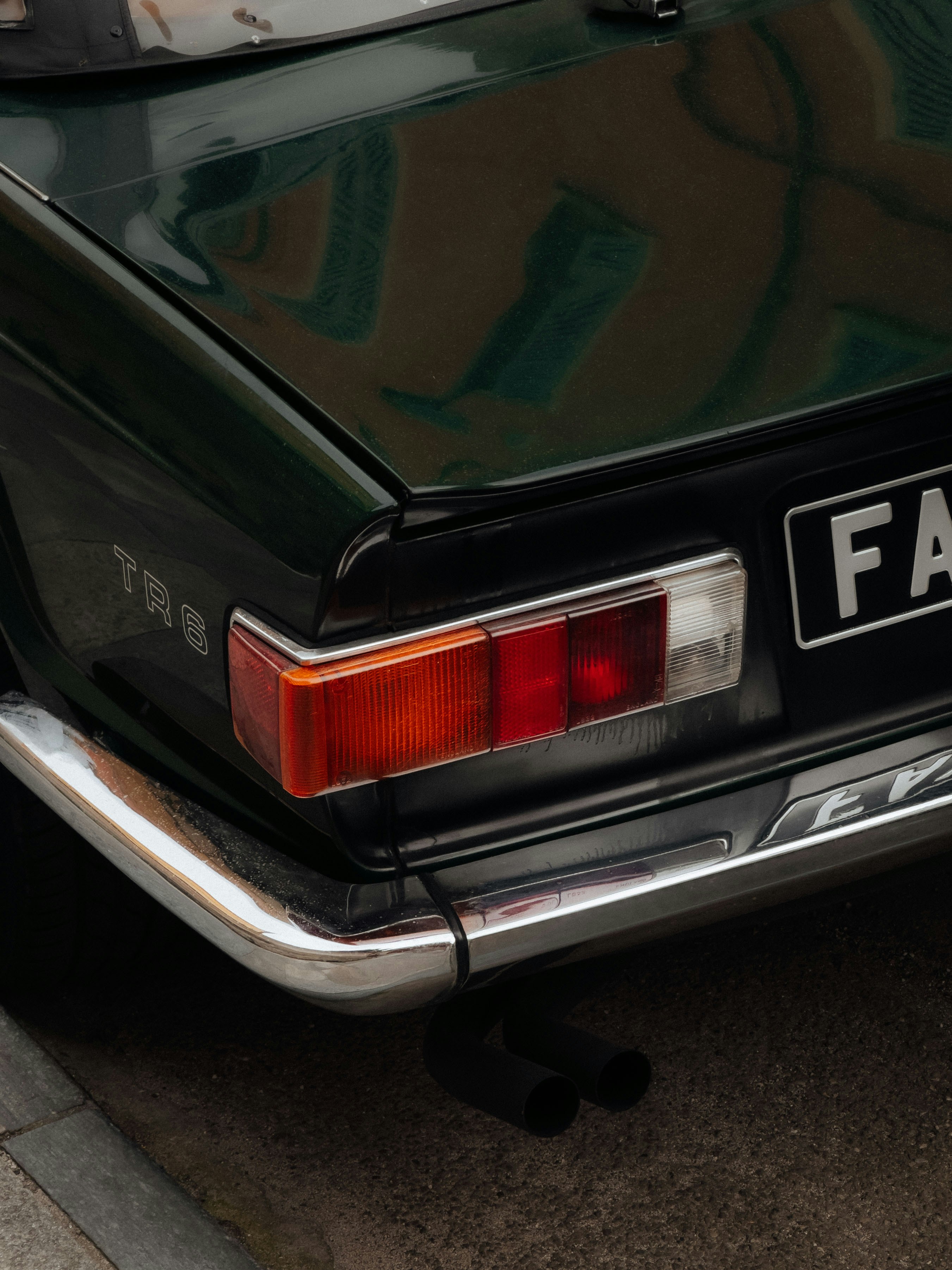 A close up of a car parked on the side of the road photo – Free Green ...