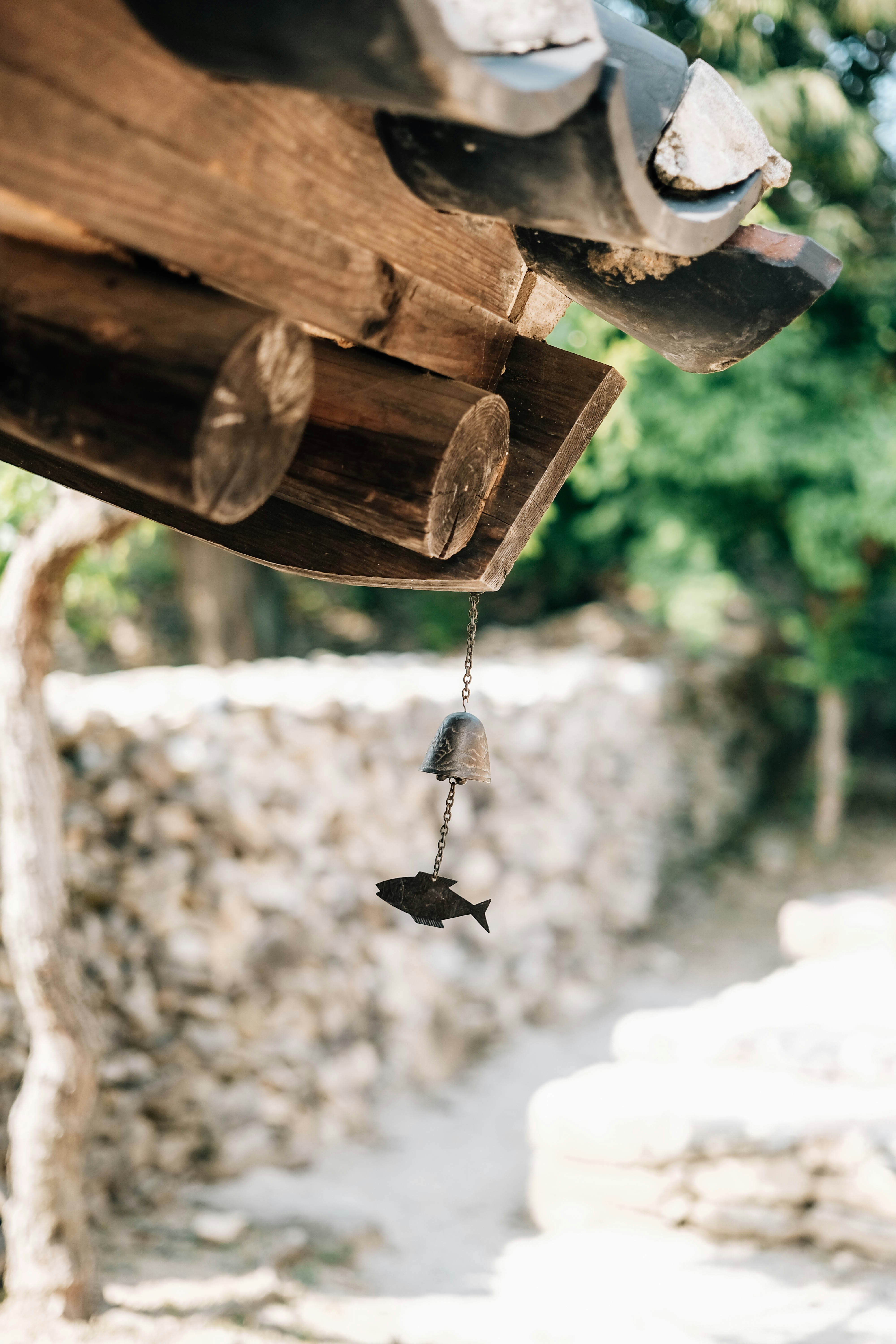 A wooden structure with bells hanging from it photo – Free Countryside ...