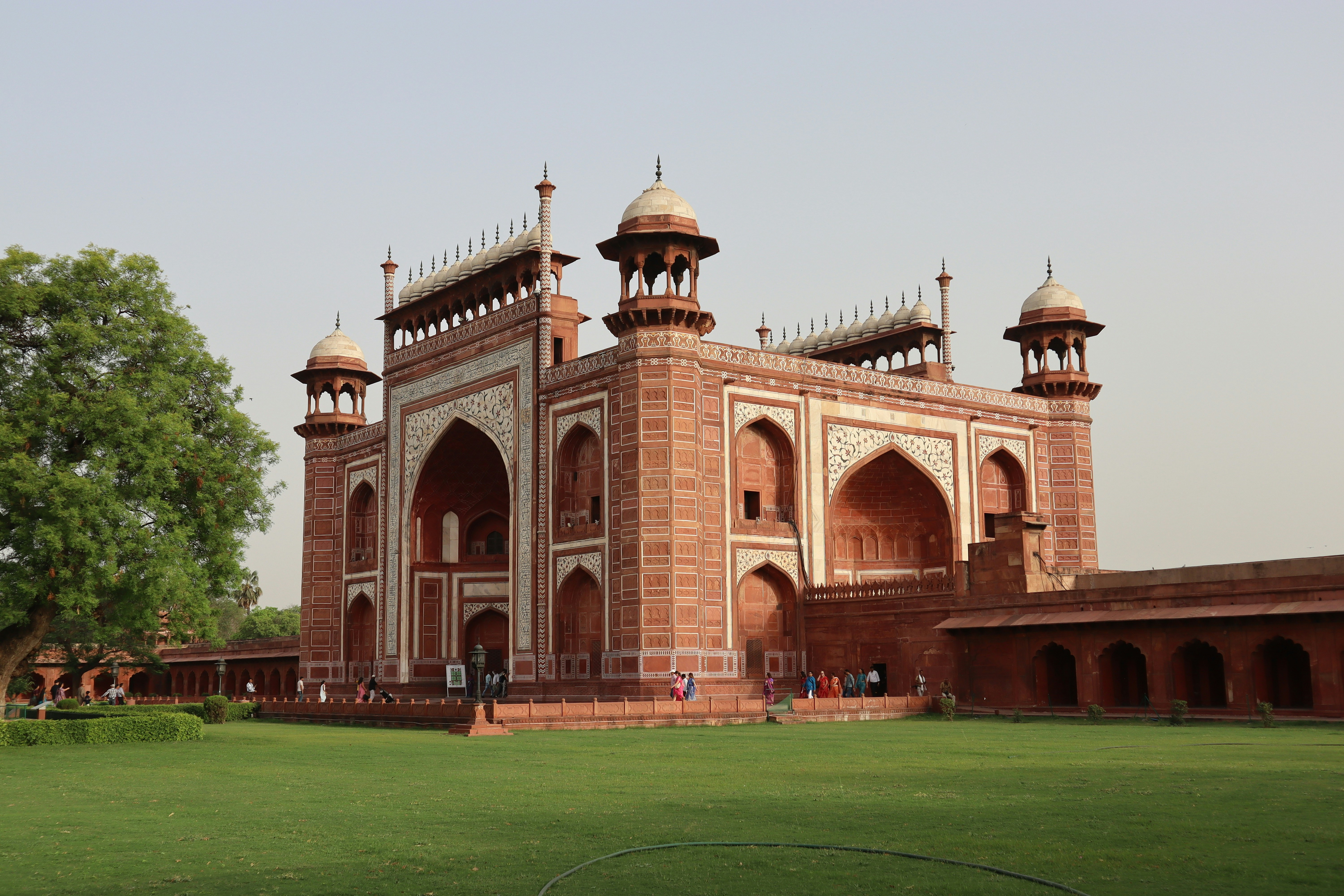 A large brick building with two towers on top of it photo – Free Taj ...