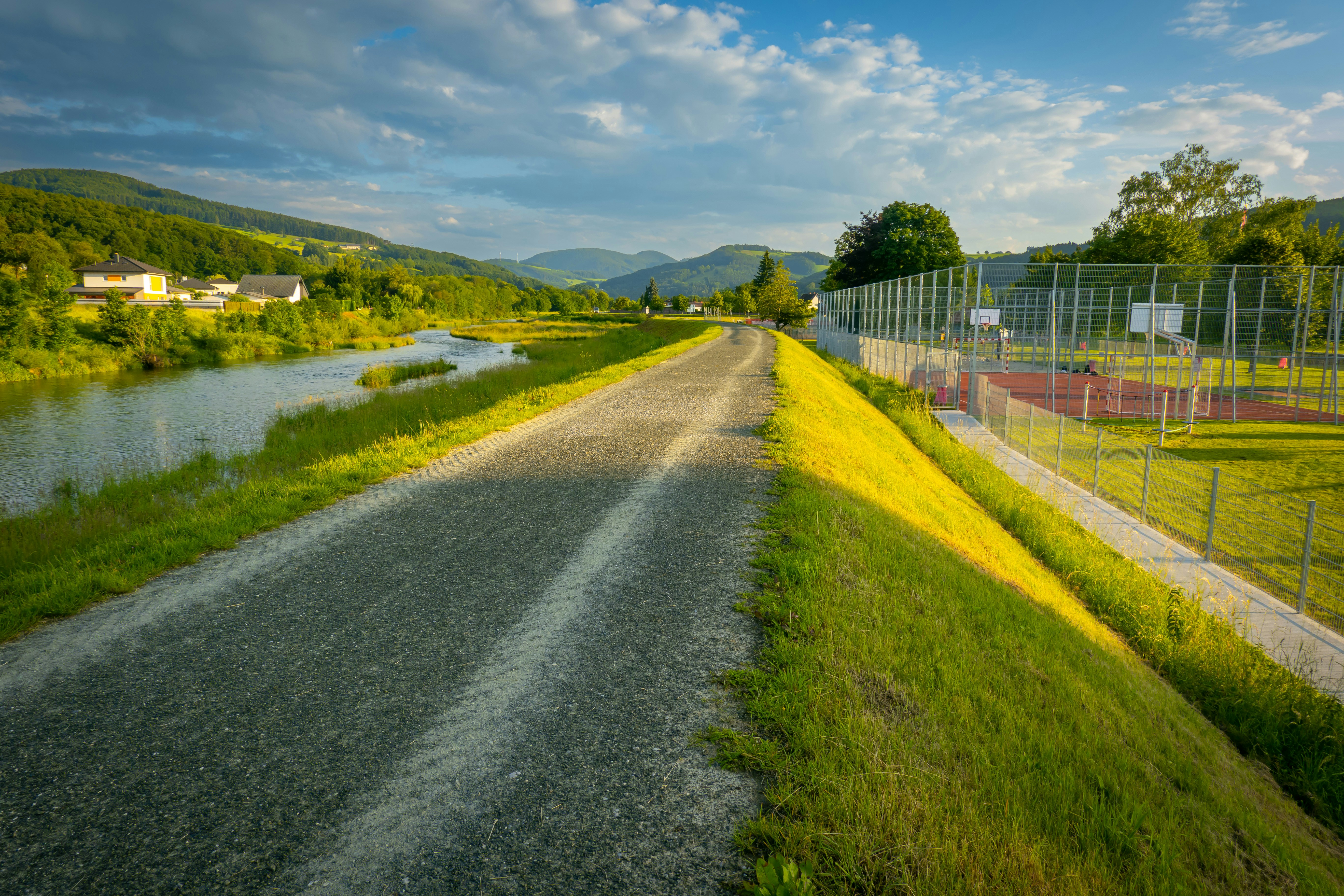 Towpath Convergence: River Left, Field Right, Horizon Ahead