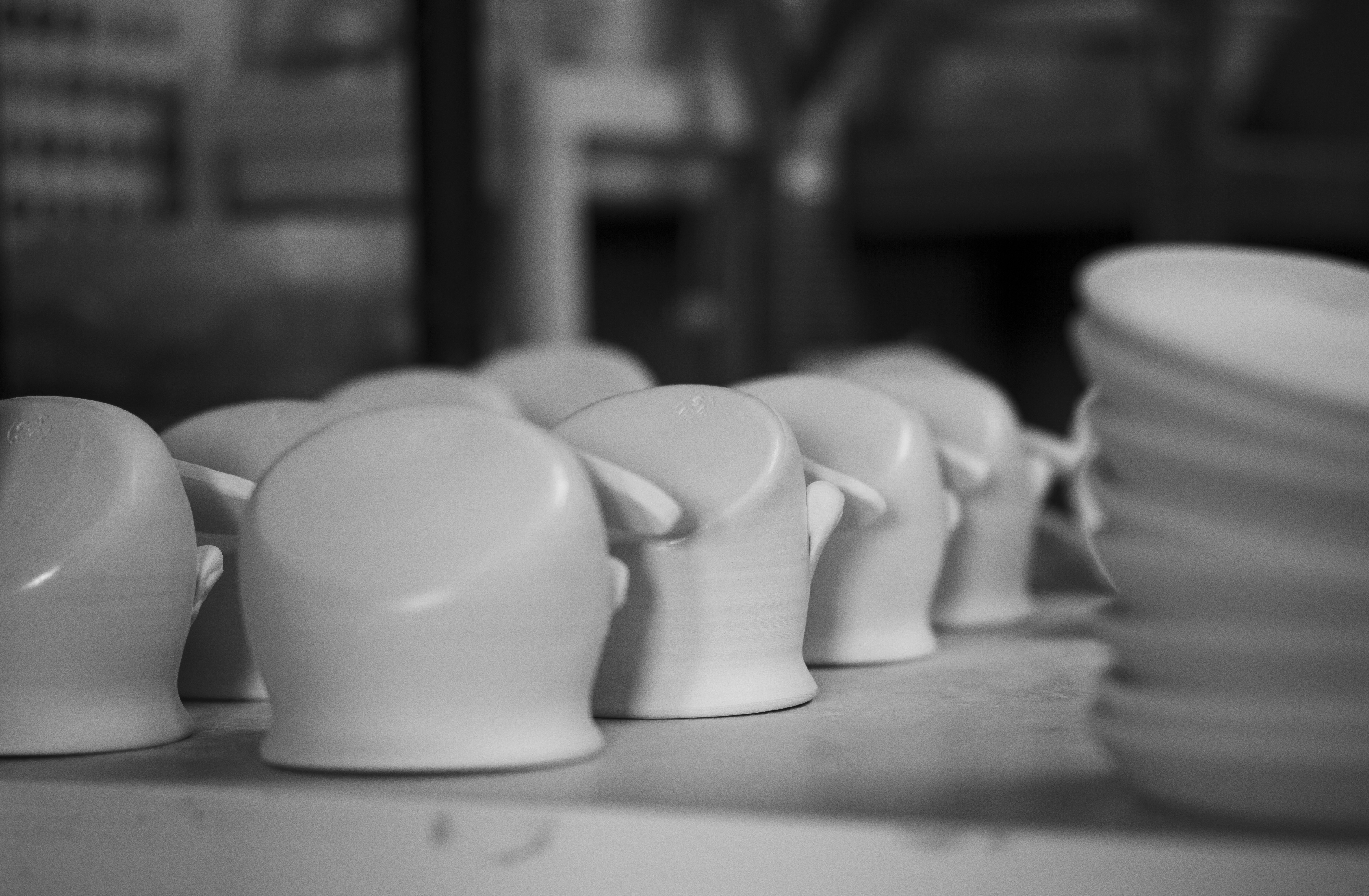 Silent Lineup: White Chess Pawns in a Shallow Depth of Field
