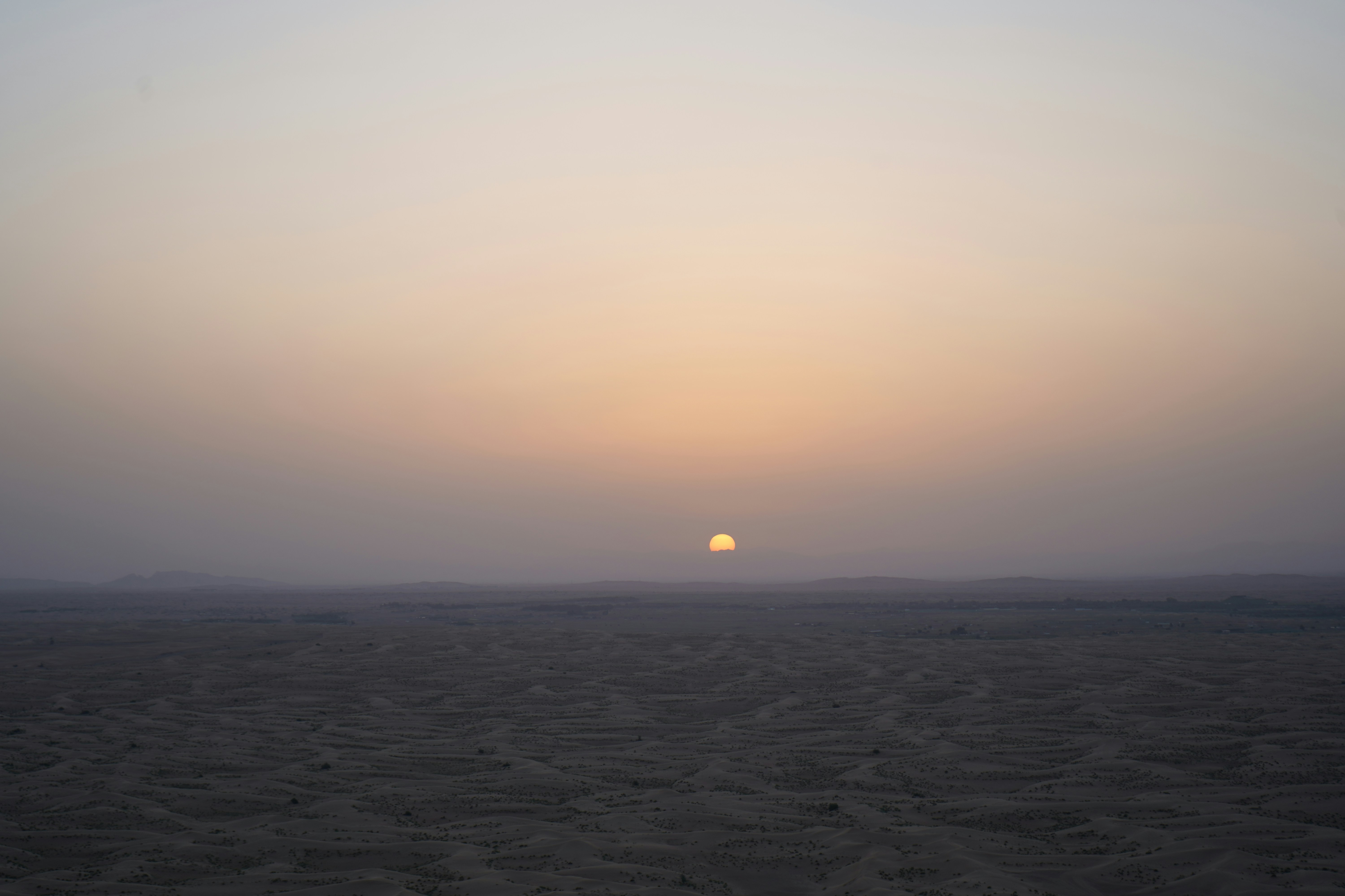 Dusk's Gentle Embrace Over the Dunes