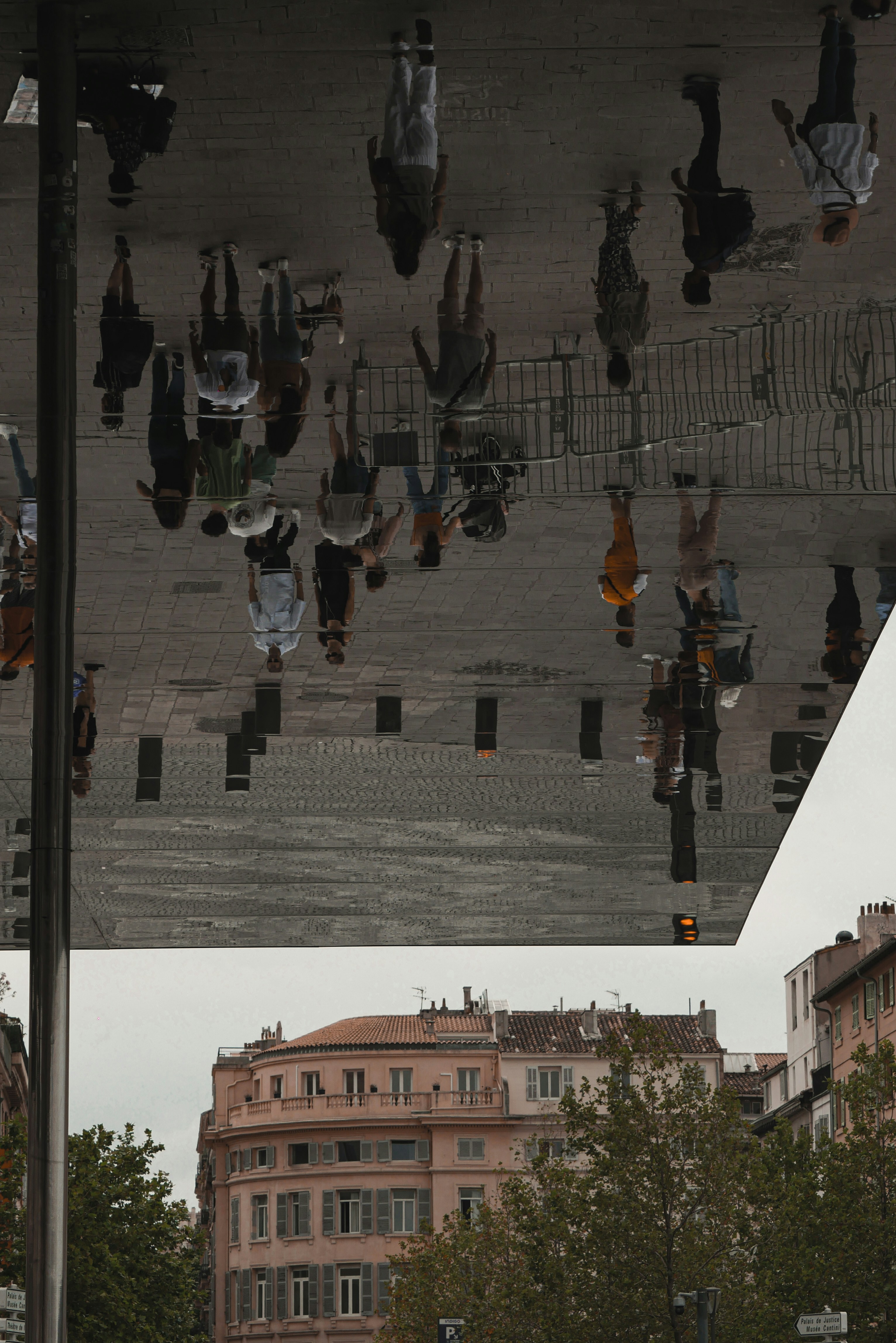 Urban Echoes on a Shiny Facade: A Crowd Reimagined