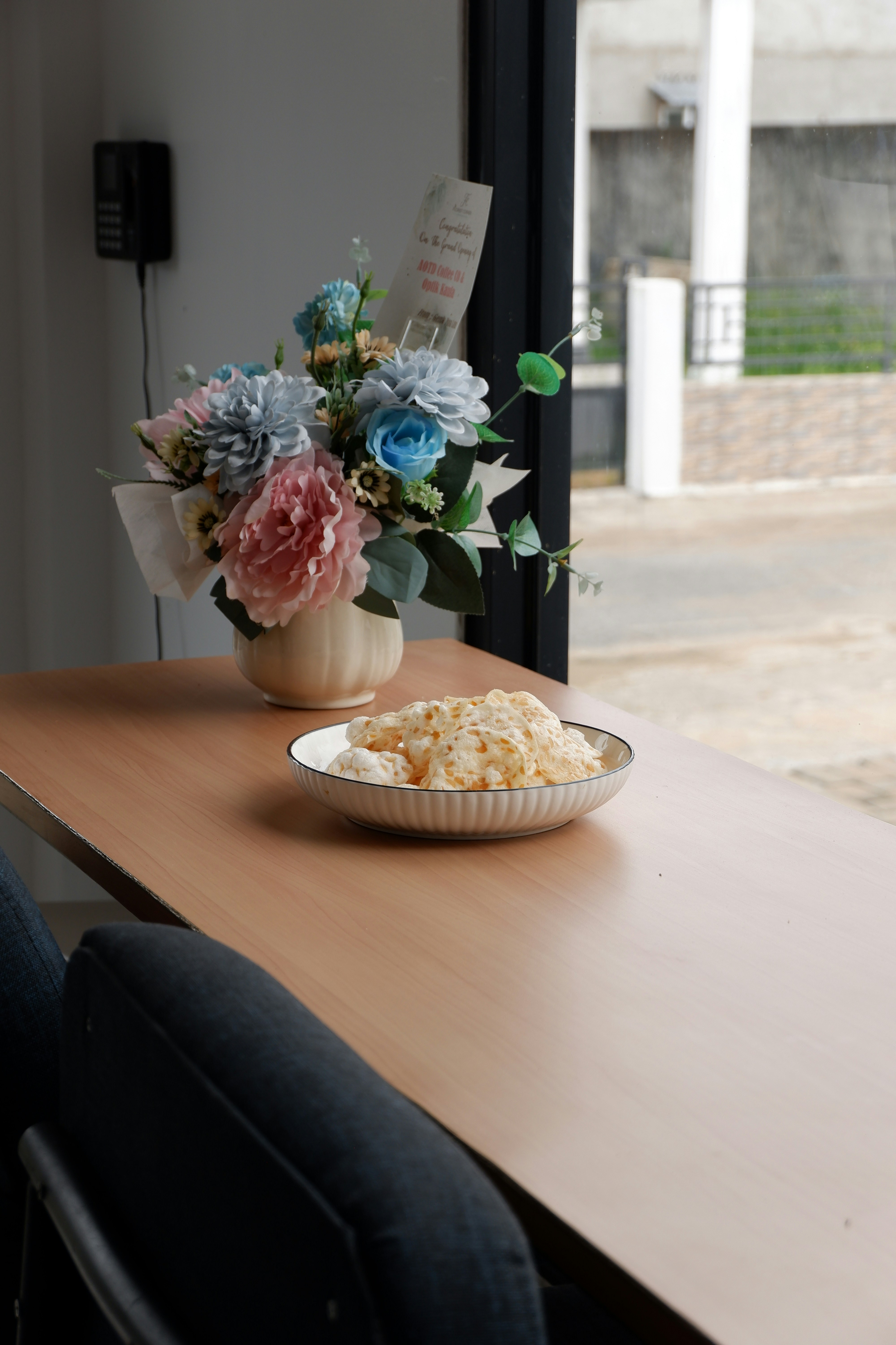 Creamy Snack by the Window: A Quiet Moment with Flowers