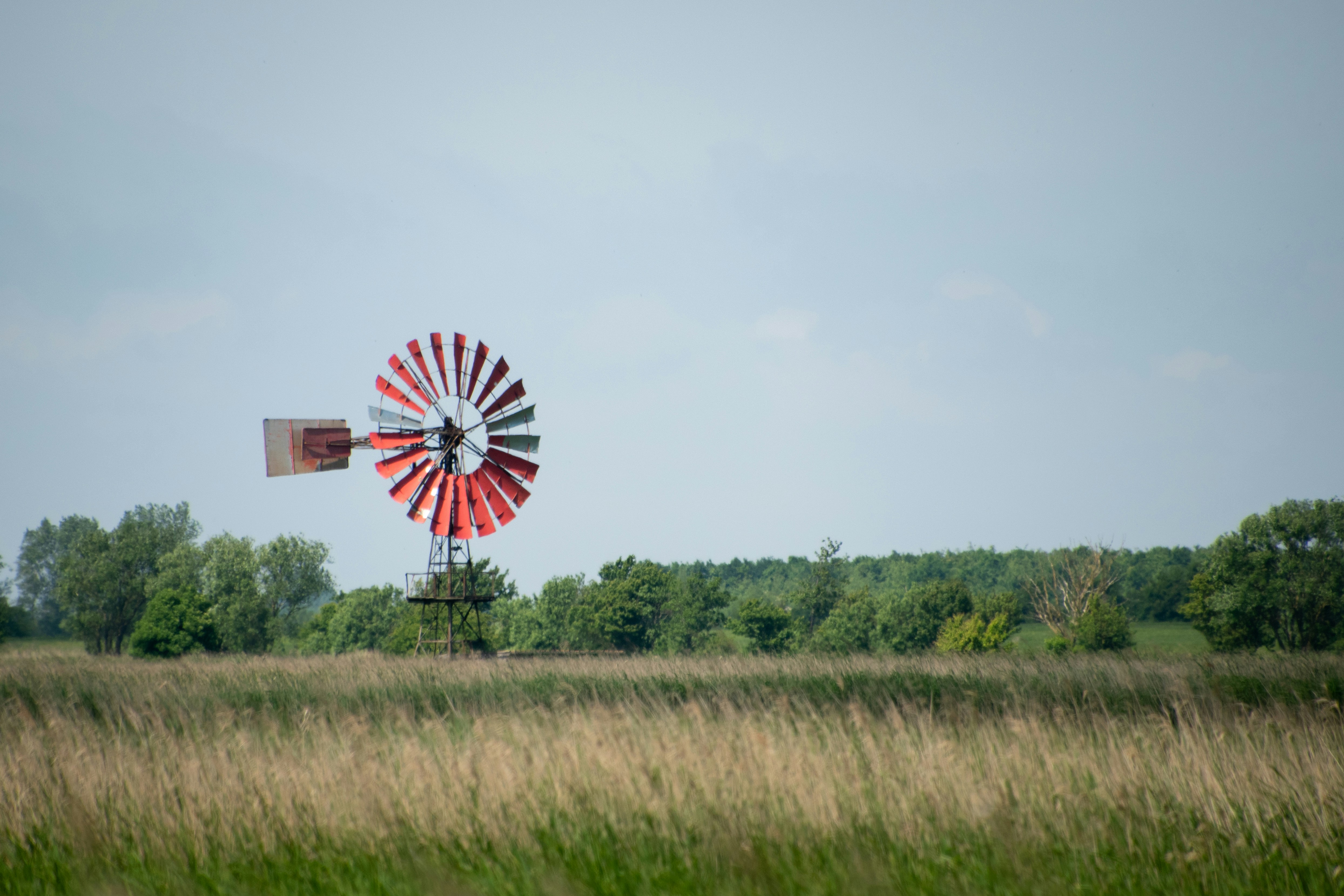 Red Pinwheel Windmill on a Prairie's Edge