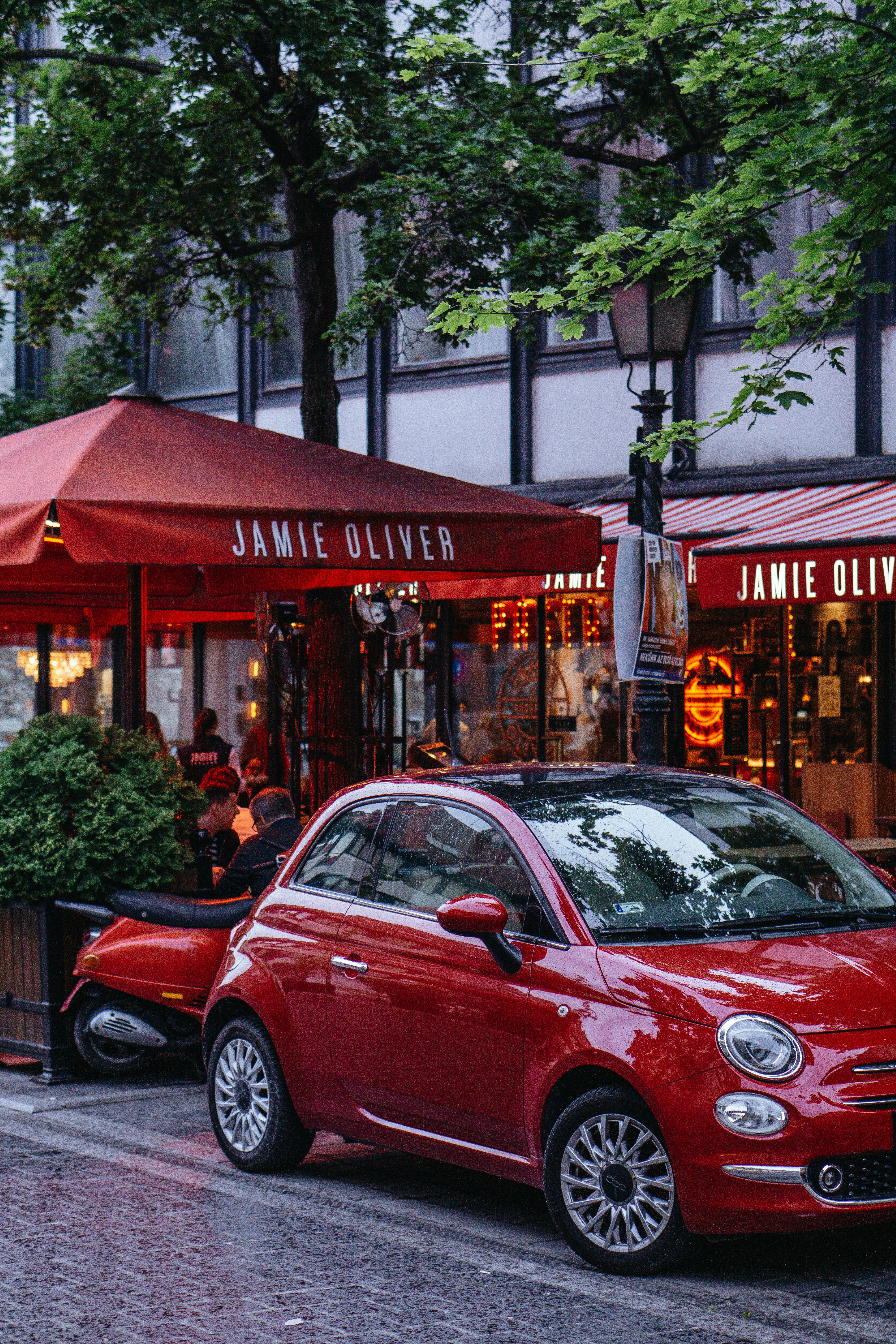 Red Fiat at a Chic Parisian Sidewalk Café