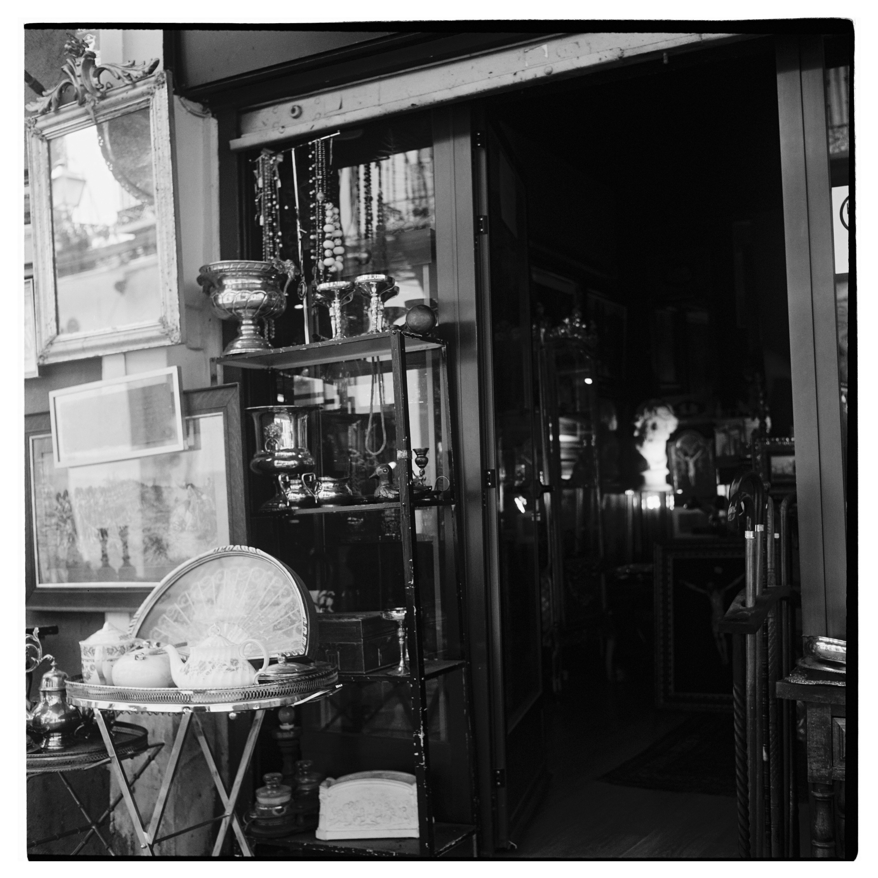 Threshold of Glass and Shadow: An Antique Shop in Mono