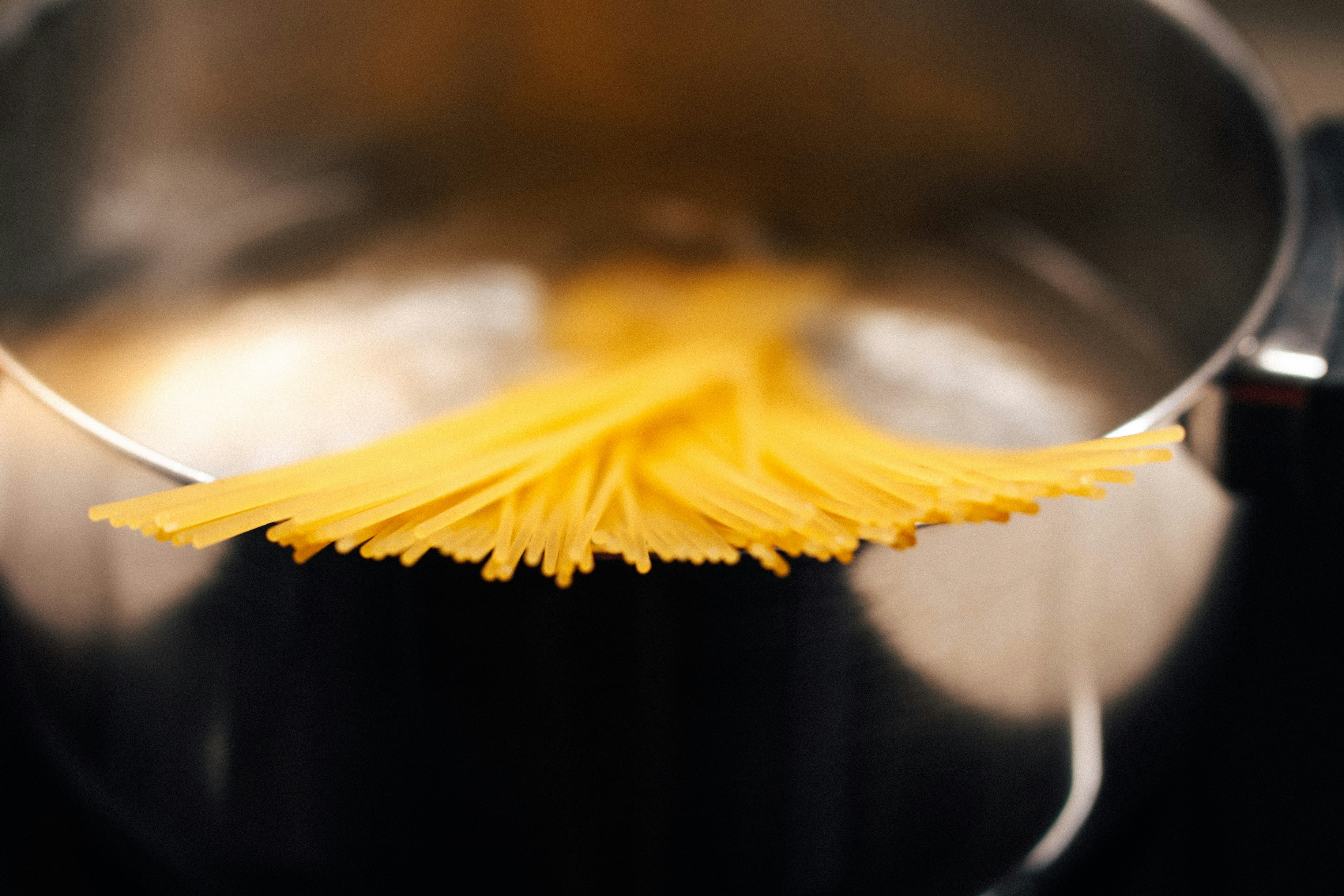 A close up of a metal pot with noodles in it photo – Free Cooking Image ...