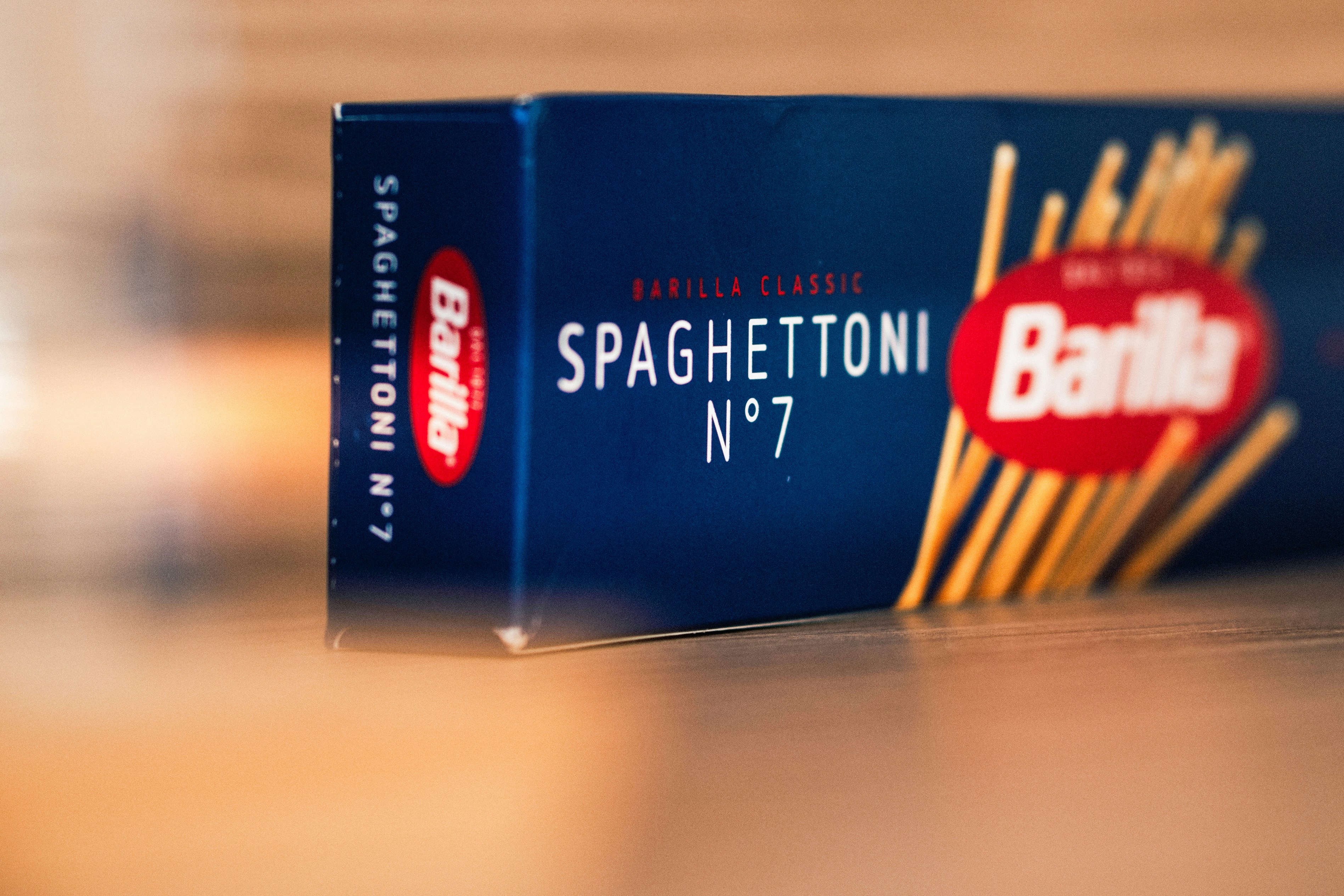 A box of spaghetti sitting on top of a table photo – Free Cooking Image ...