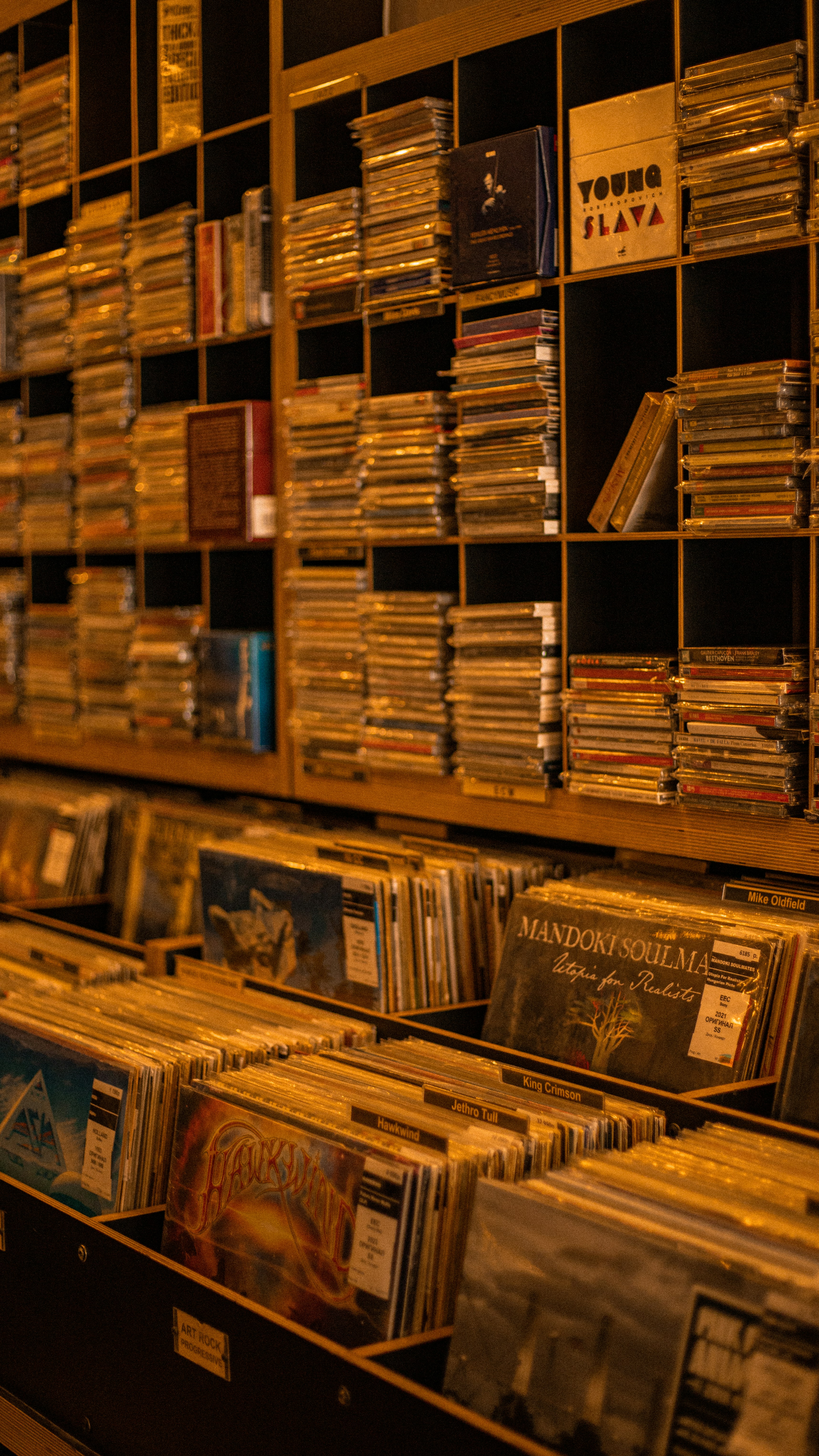 A large collection of cd's in a store photo – Free Brown Image on Unsplash