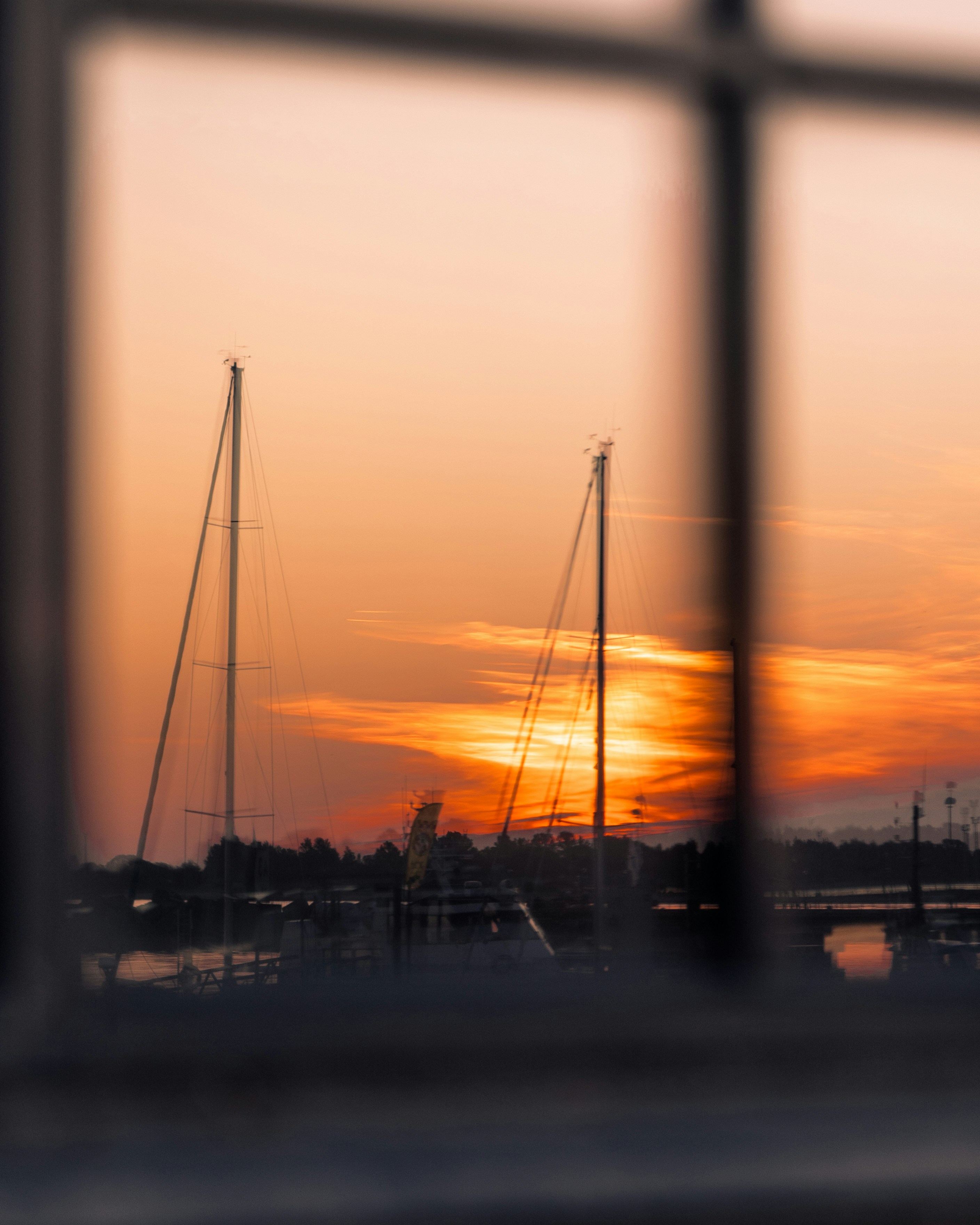 A view of a sunset through a window photo – Free Estonia Image on Unsplash