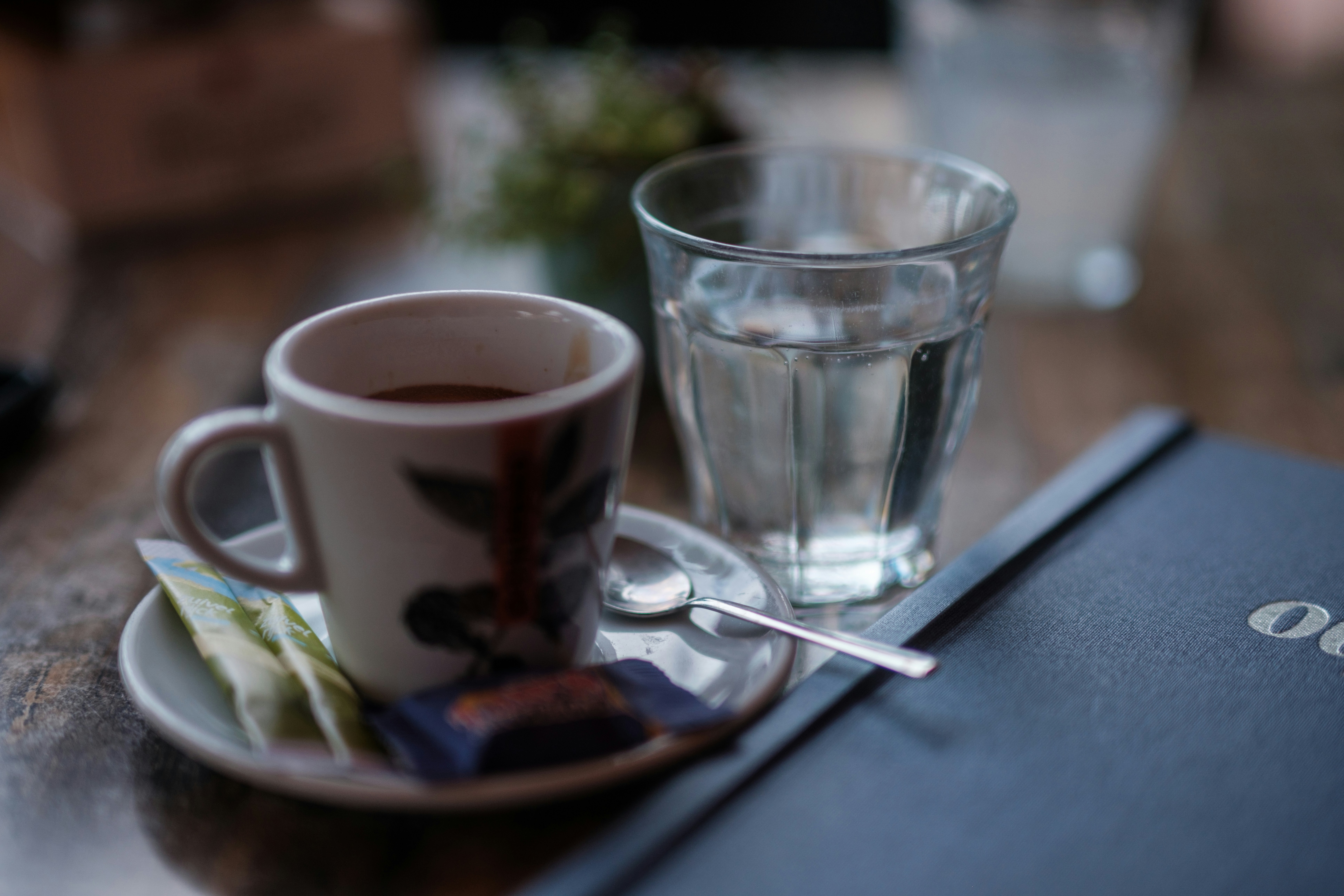 A cup of tea and a book on a table photo – Free Grey Image on Unsplash