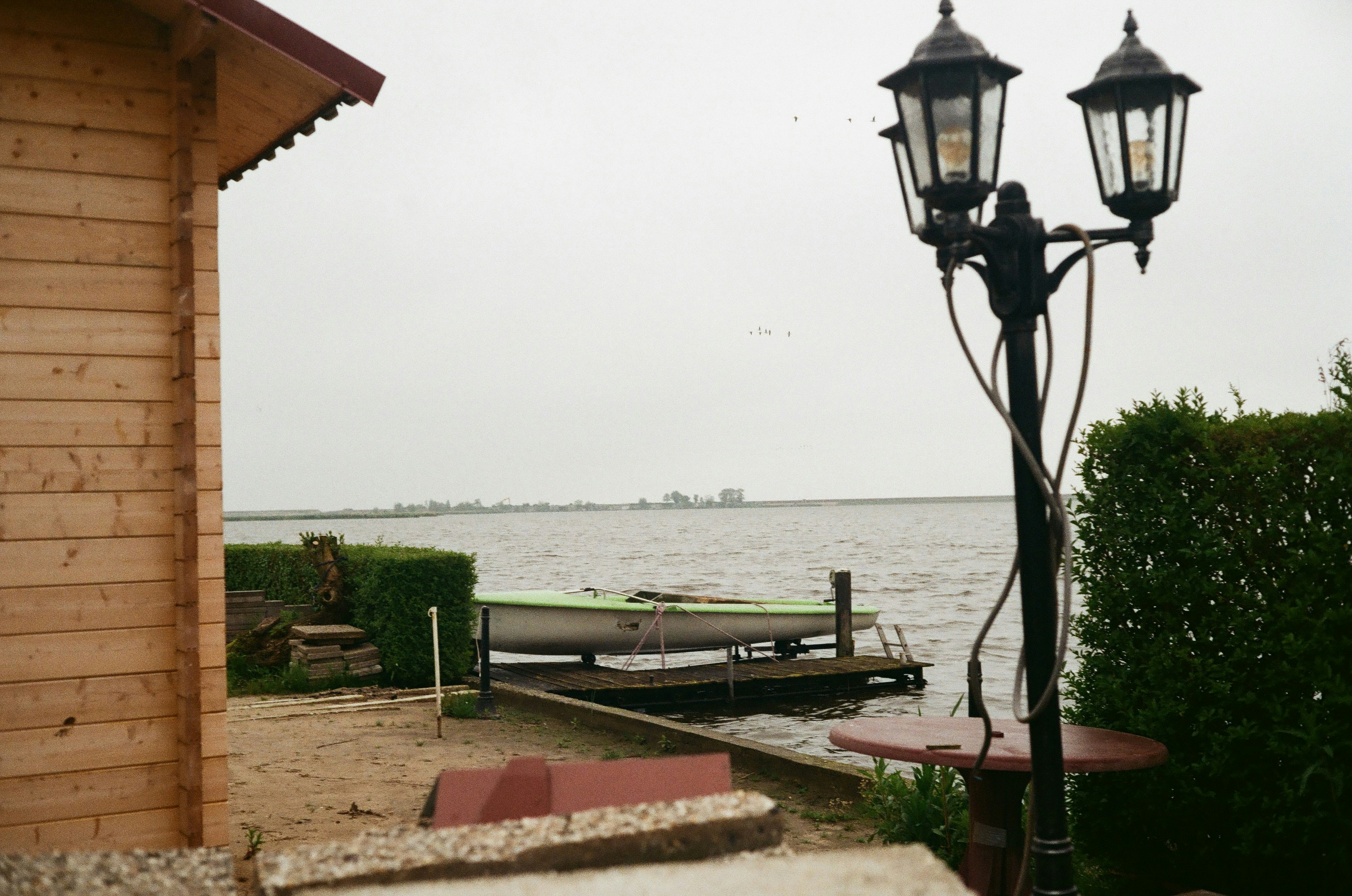 Lamplight Over the Quiet Shore: A Dockside Frame