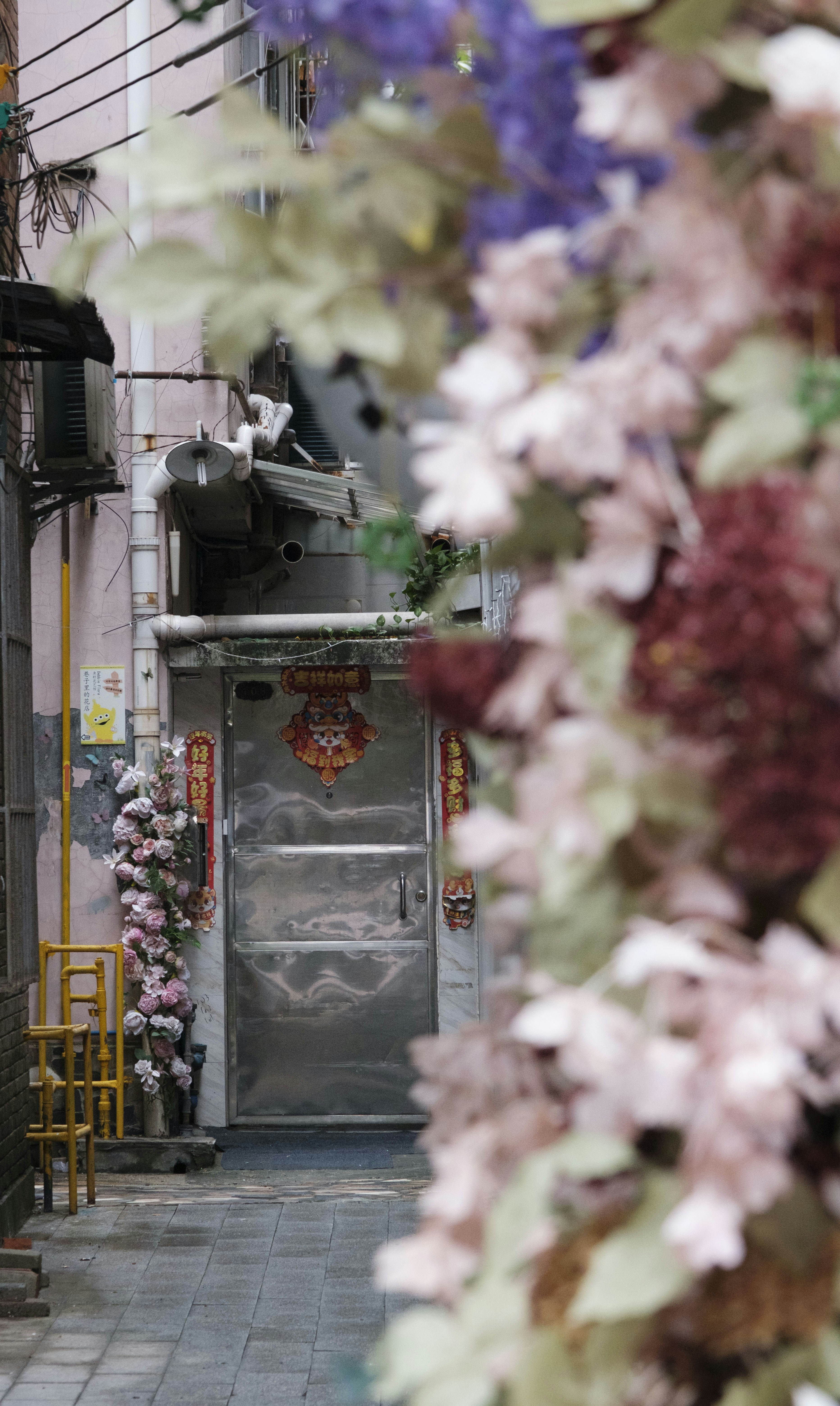 a street with a bunch of flowers on the side of it