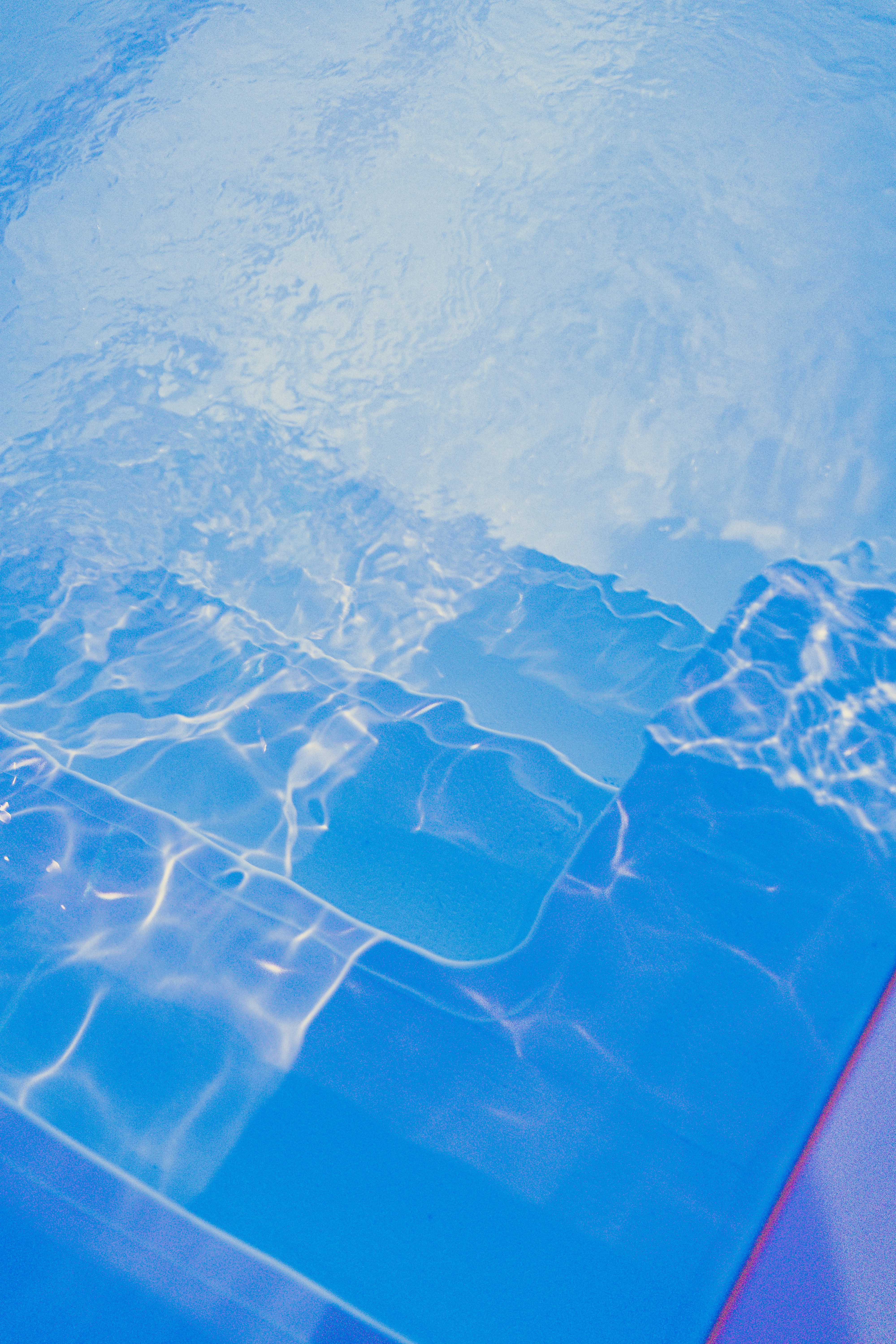 A blue swimming pool with clear blue water photo – Free Blue Image on ...