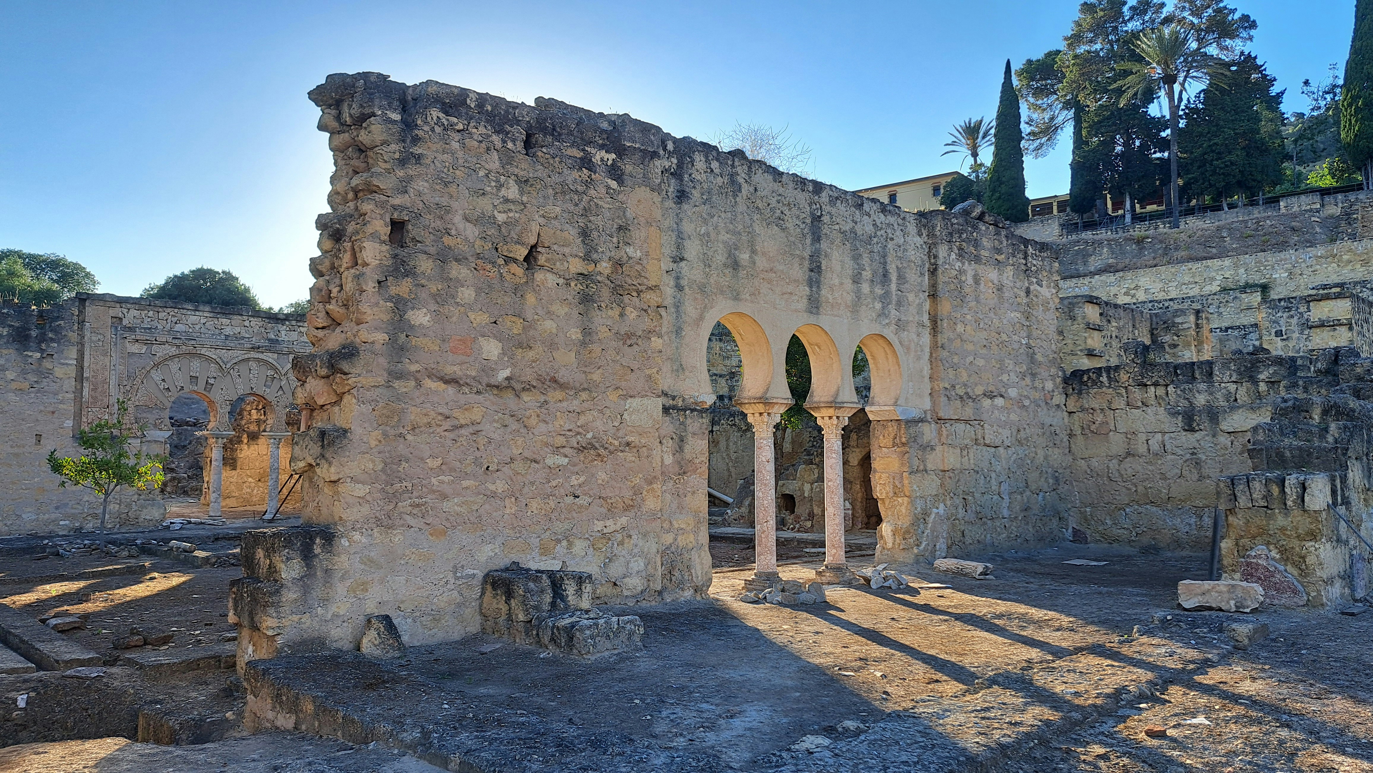 The ruins of an old building with arches and windows photo – Free ...