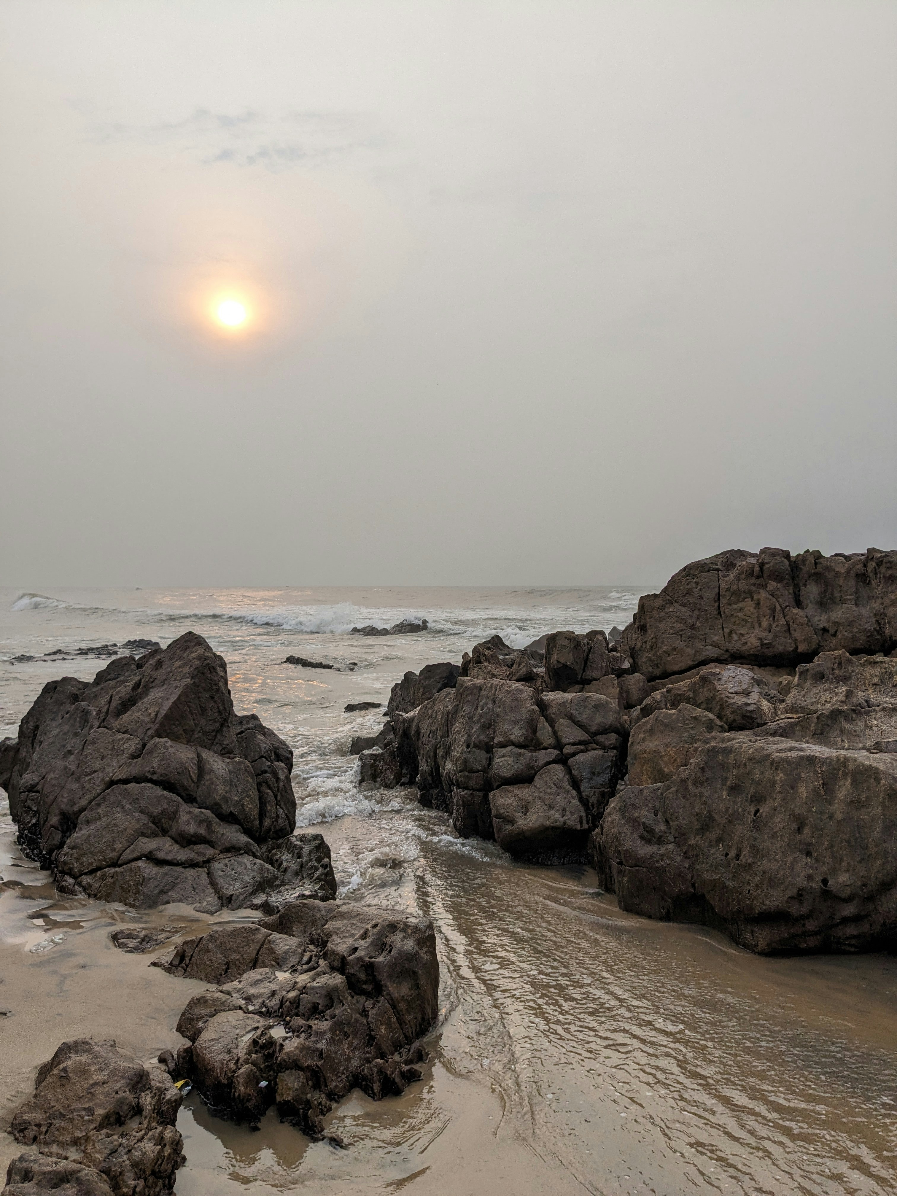 Rugged Tides at Dusk: Limestone Relics Emersed by Quiet Seas