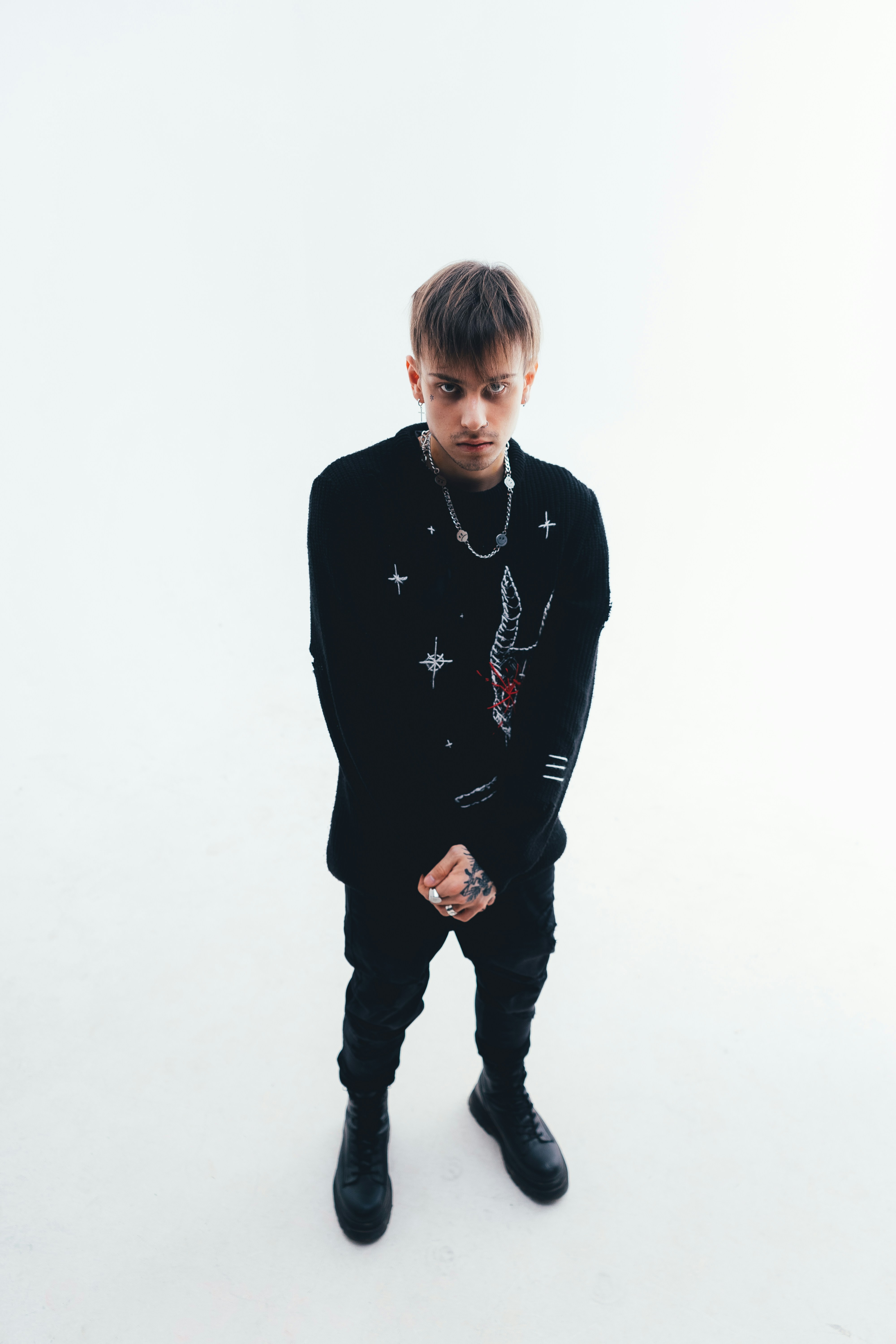 Monochrome Edge: A Black-Clad Portrait in a Pure Studio