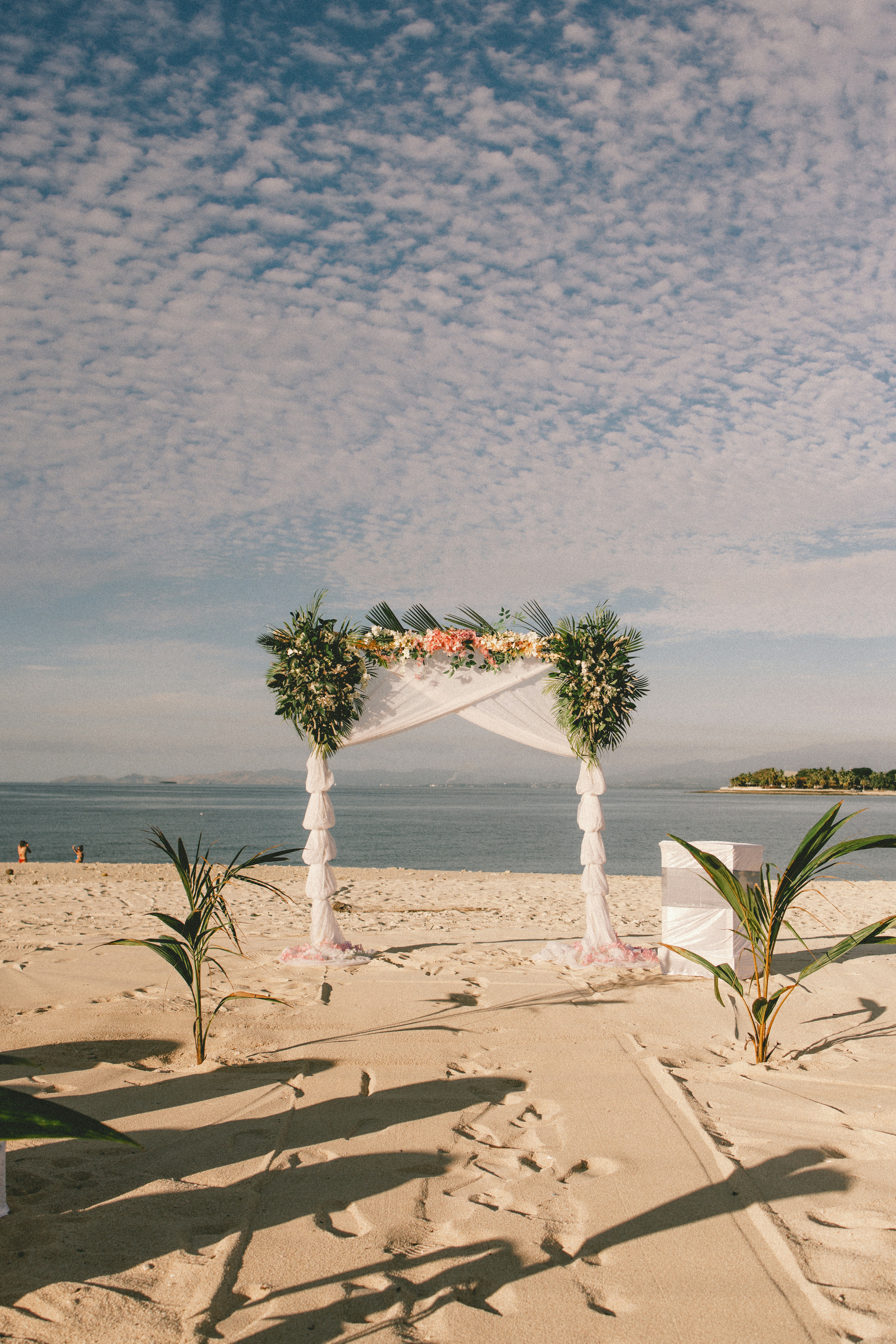 A wedding setup on the beach with flowers and greenery photo – Free ...