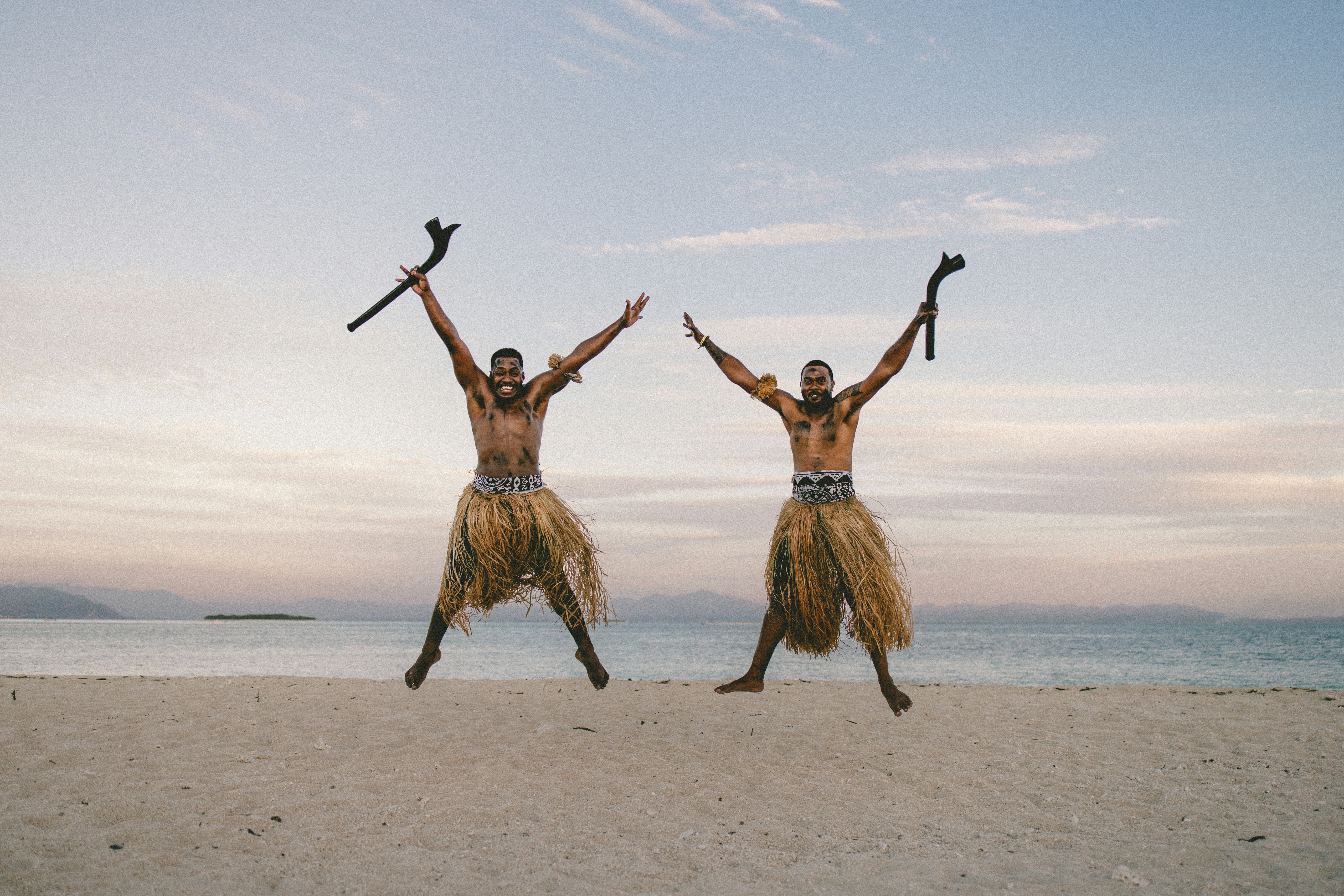 Beachcomber Island, Fiji, by Josh Withers wedding and elopement celebrant | a couple of men standing on top of a sandy beach