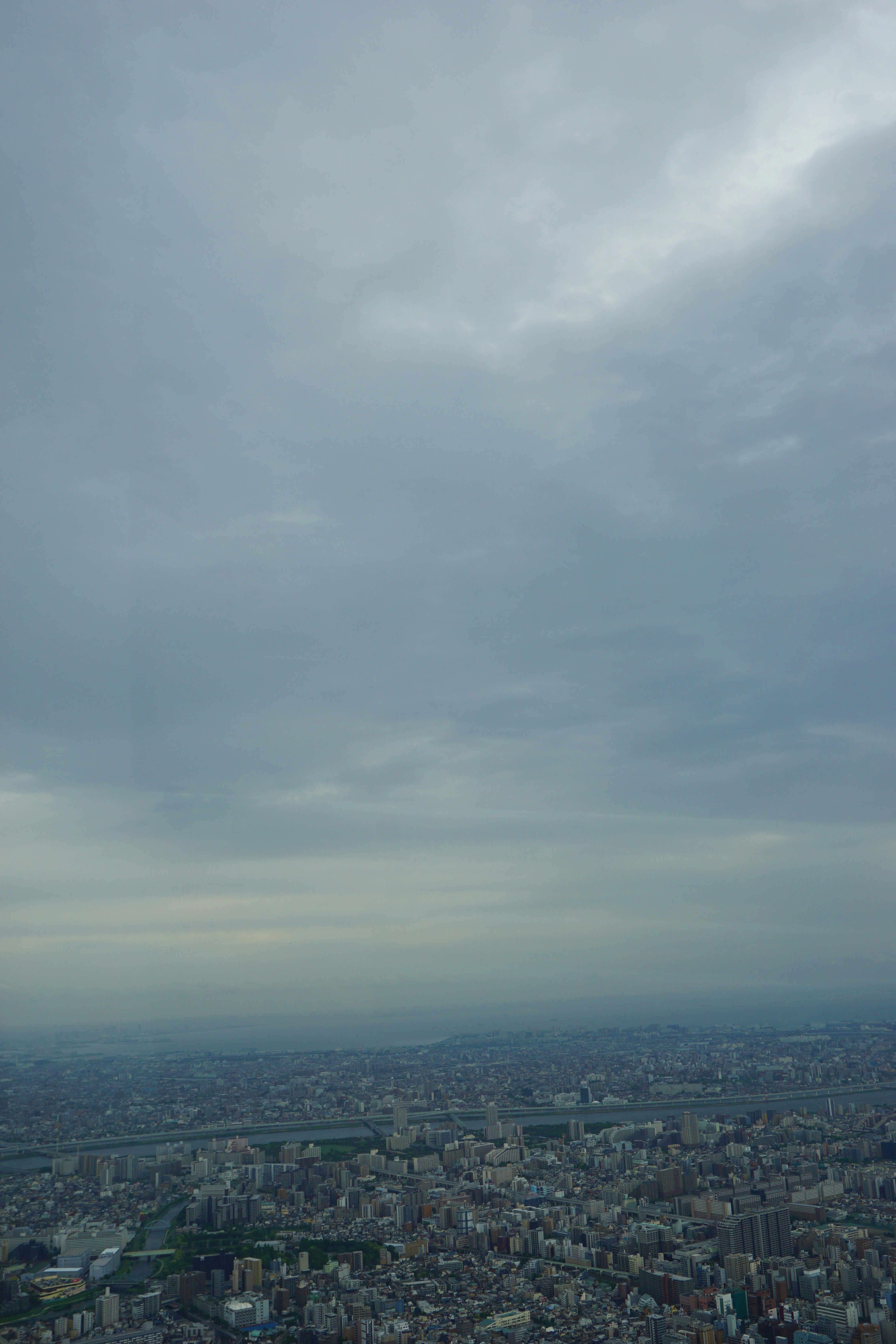 Horizon Under a Layered Sky: A Panoramic Urban Tapestry