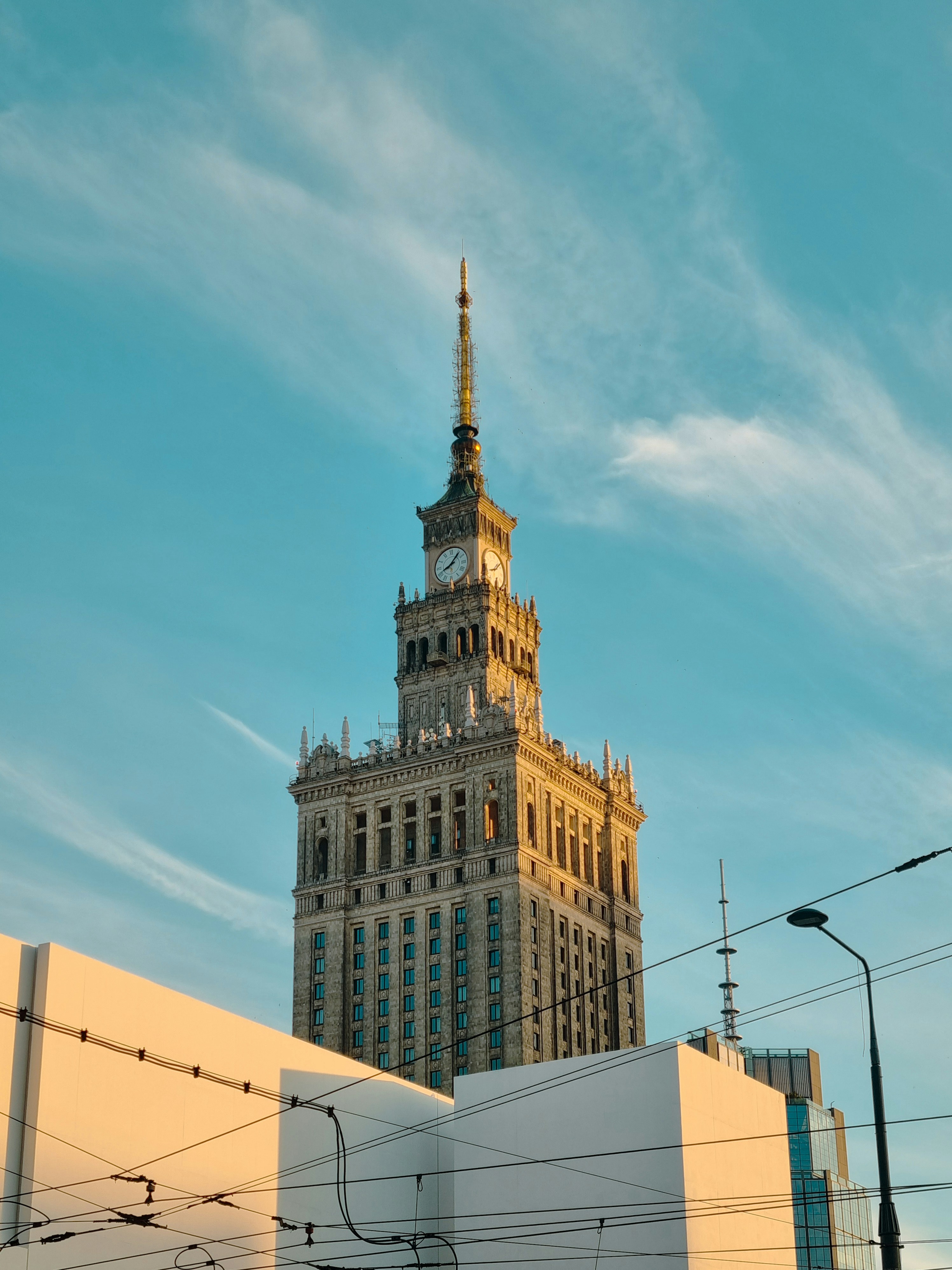 Historic skyscraper adorned with intricate architectural details against a clear blue sky, showcasing urban elegance.