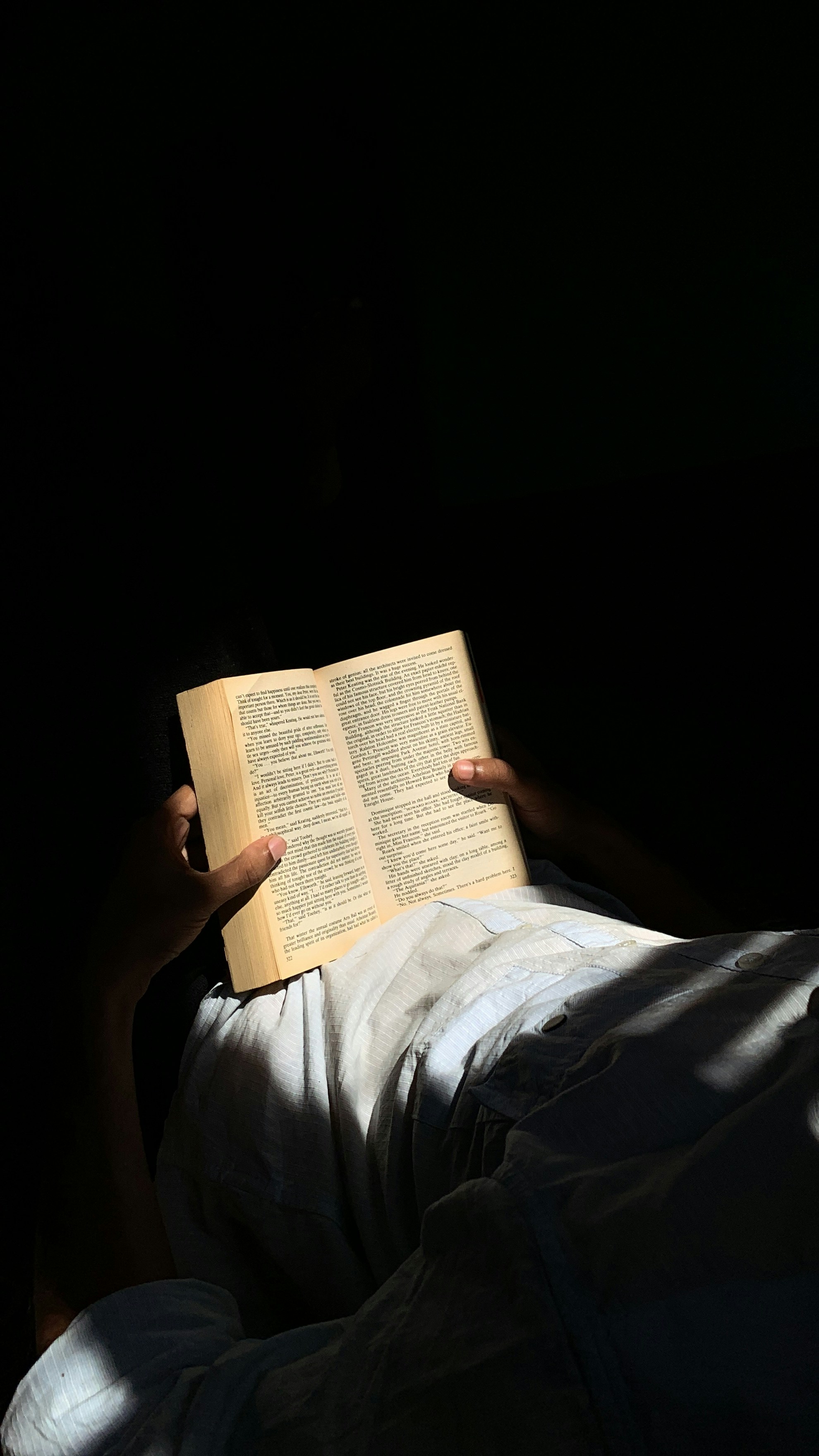 A person is reading a book in the dark photo – Free Reading Image on ...