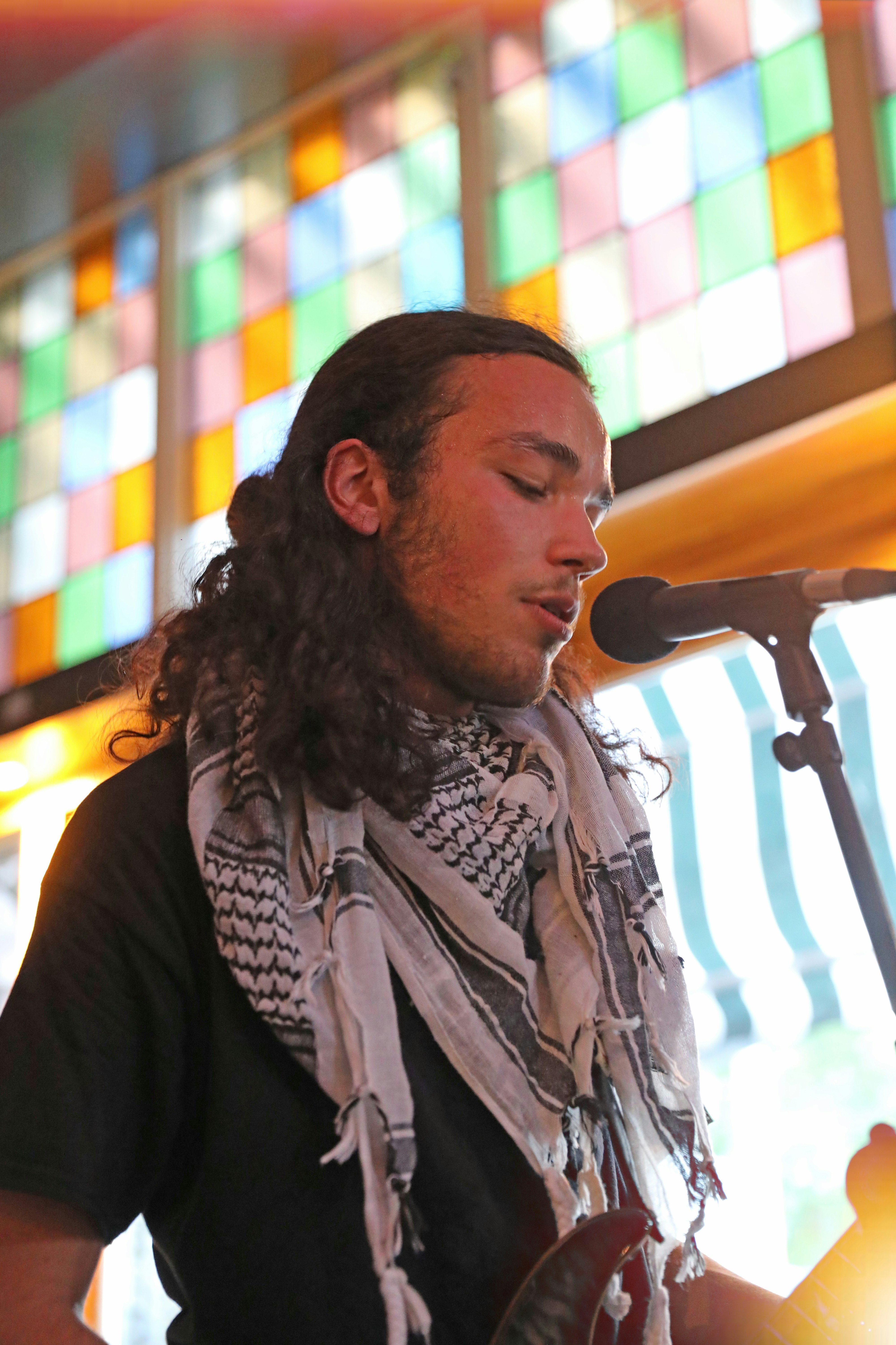 Glass Canopy Ballad: A Singer Under Rainbow Light