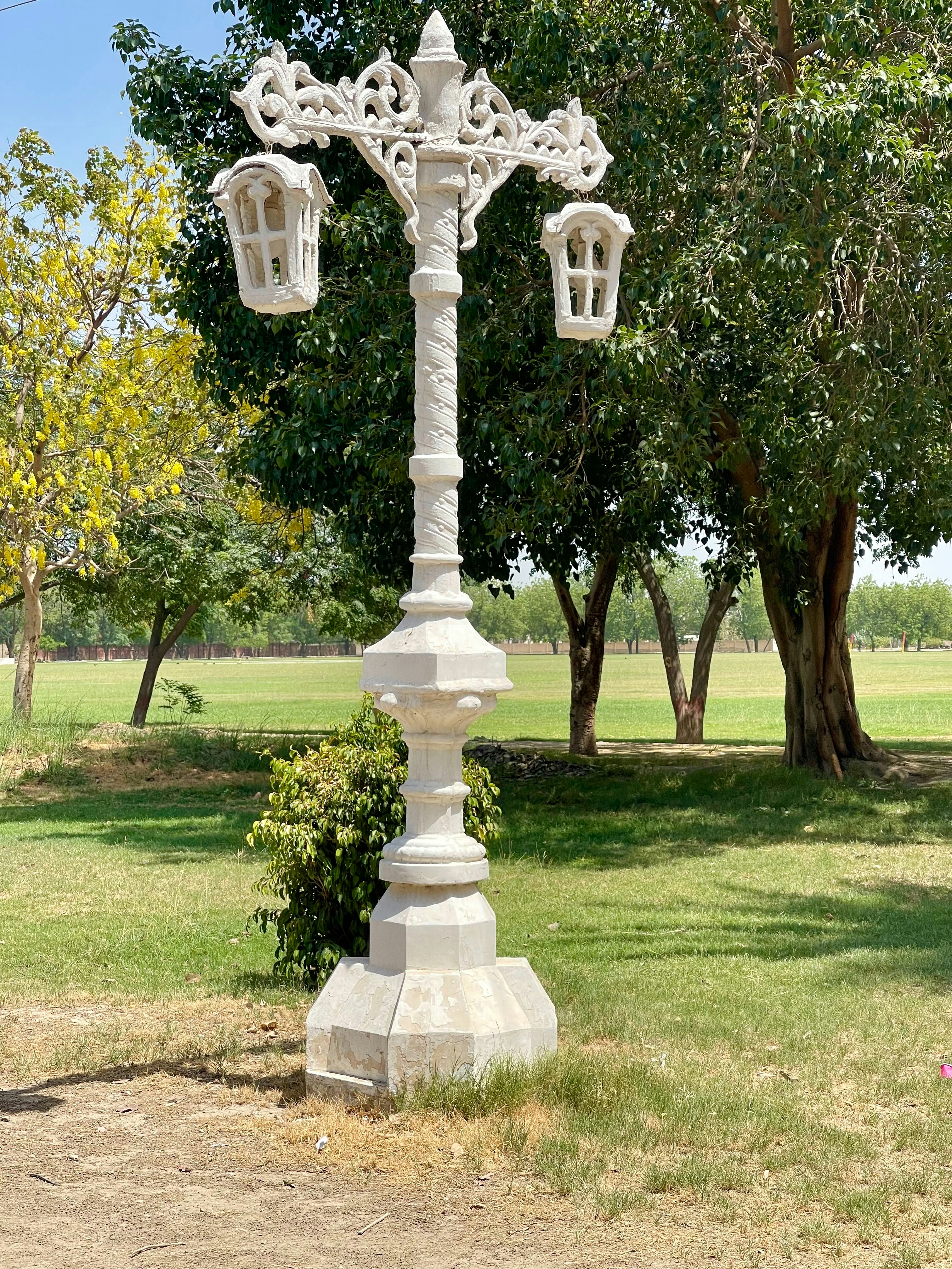 Ornate Park Lantern in a Sunlit Clearing