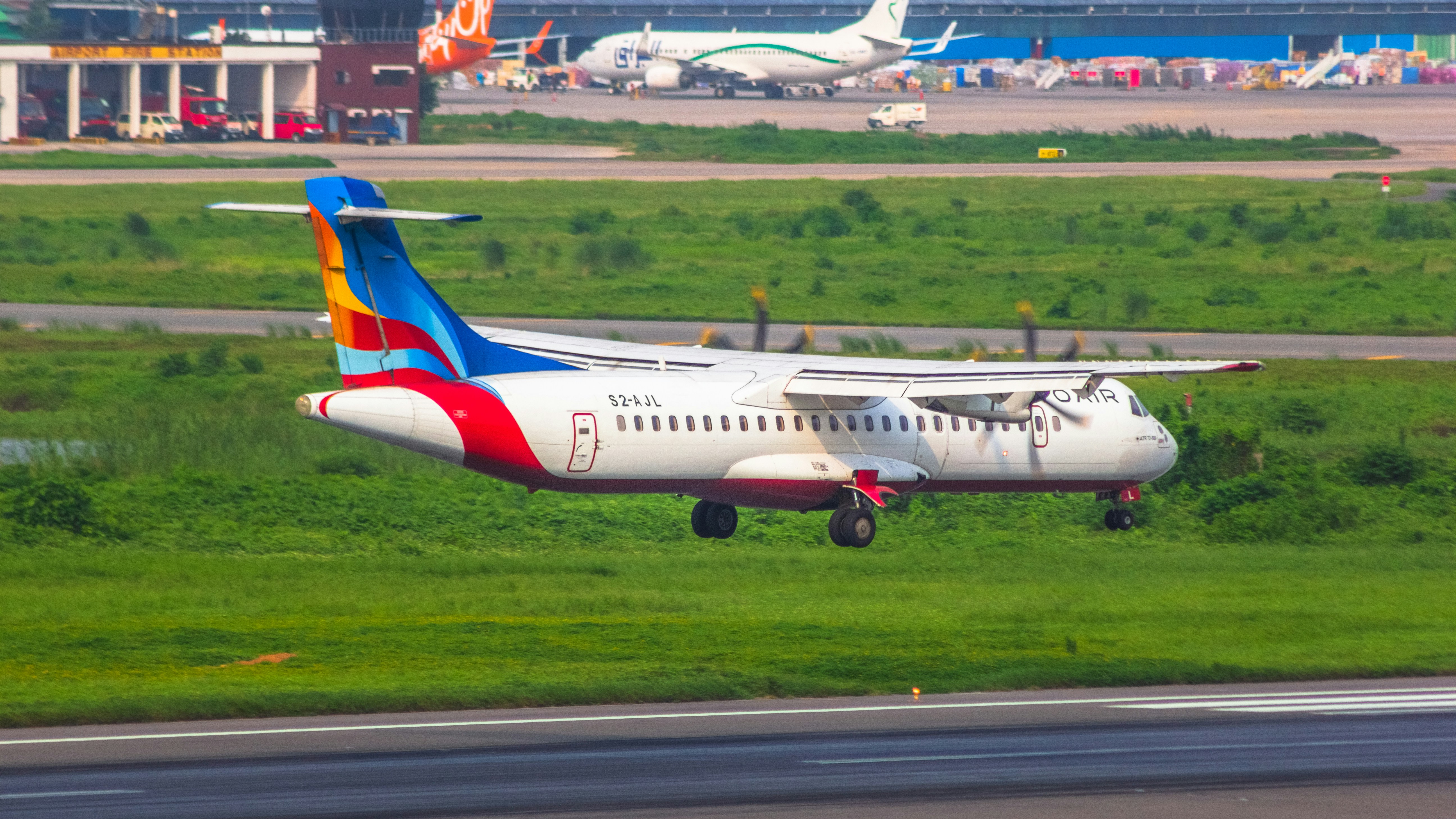 A large passenger jet taking off from an airport runway photo – Free ...