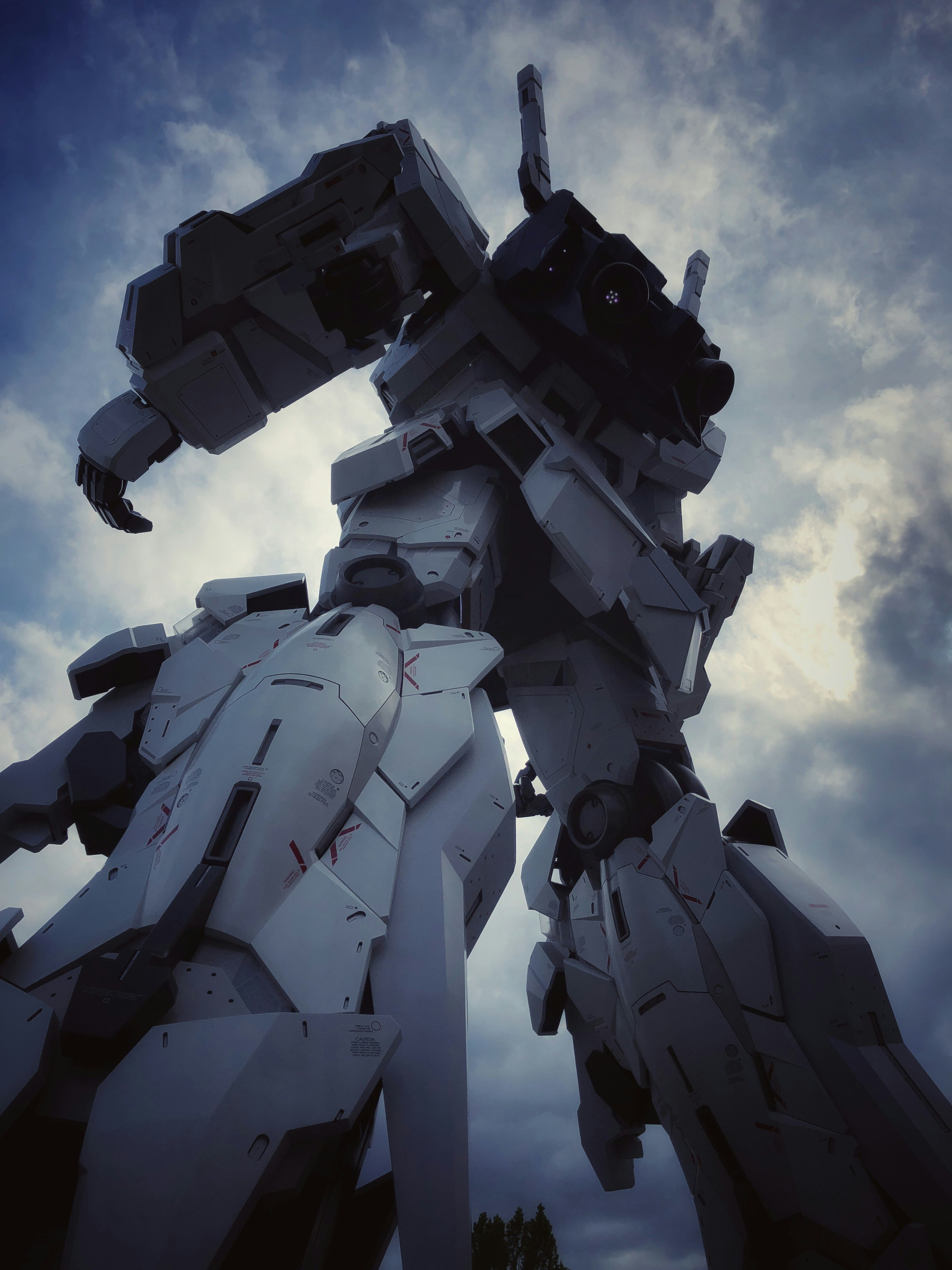 UNICORN GUNDAM in Tokyo お台場 | a giant robot like object in front of a cloudy sky