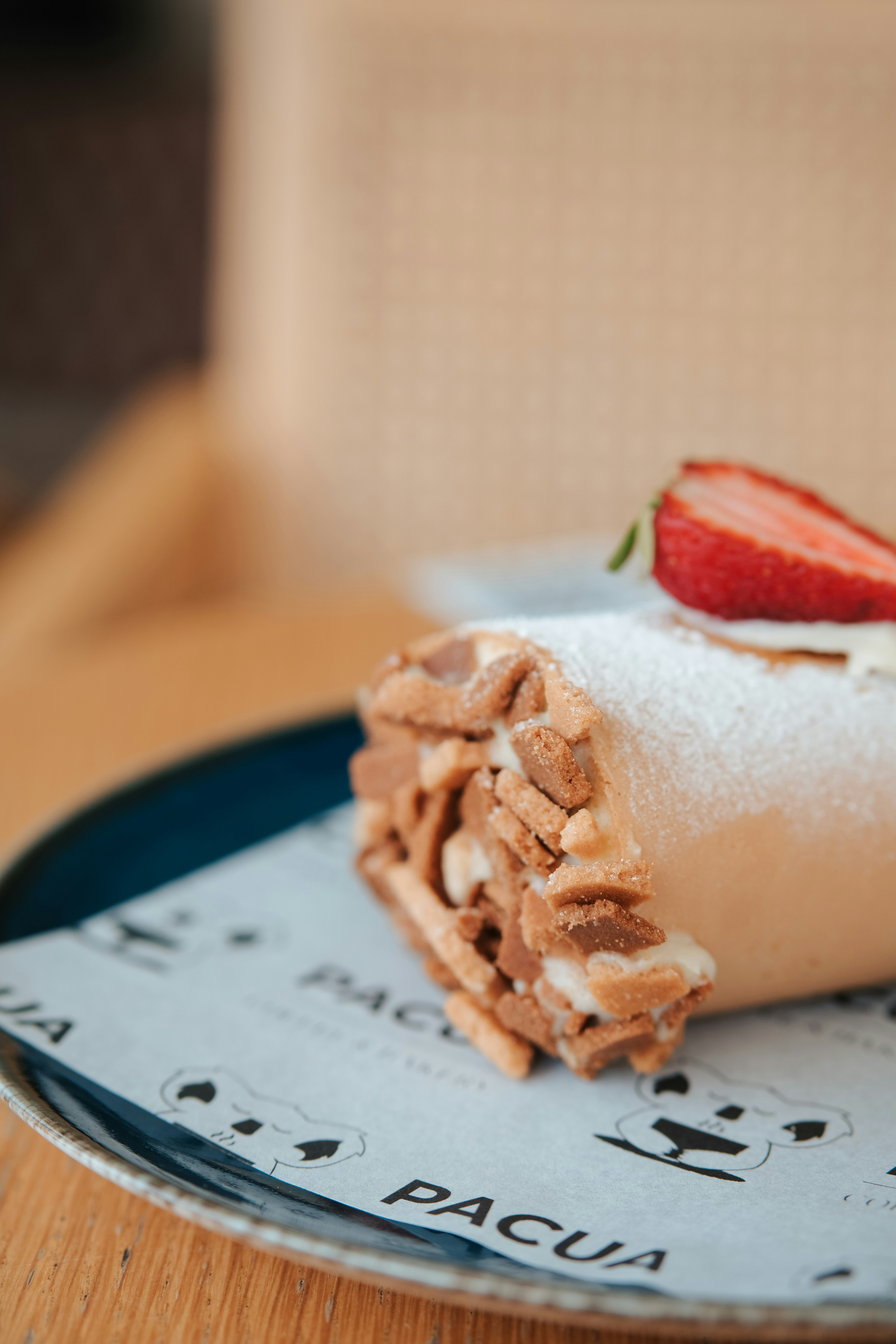 Almond-Crusted Vanilla Cake Roll with Strawberry Accent