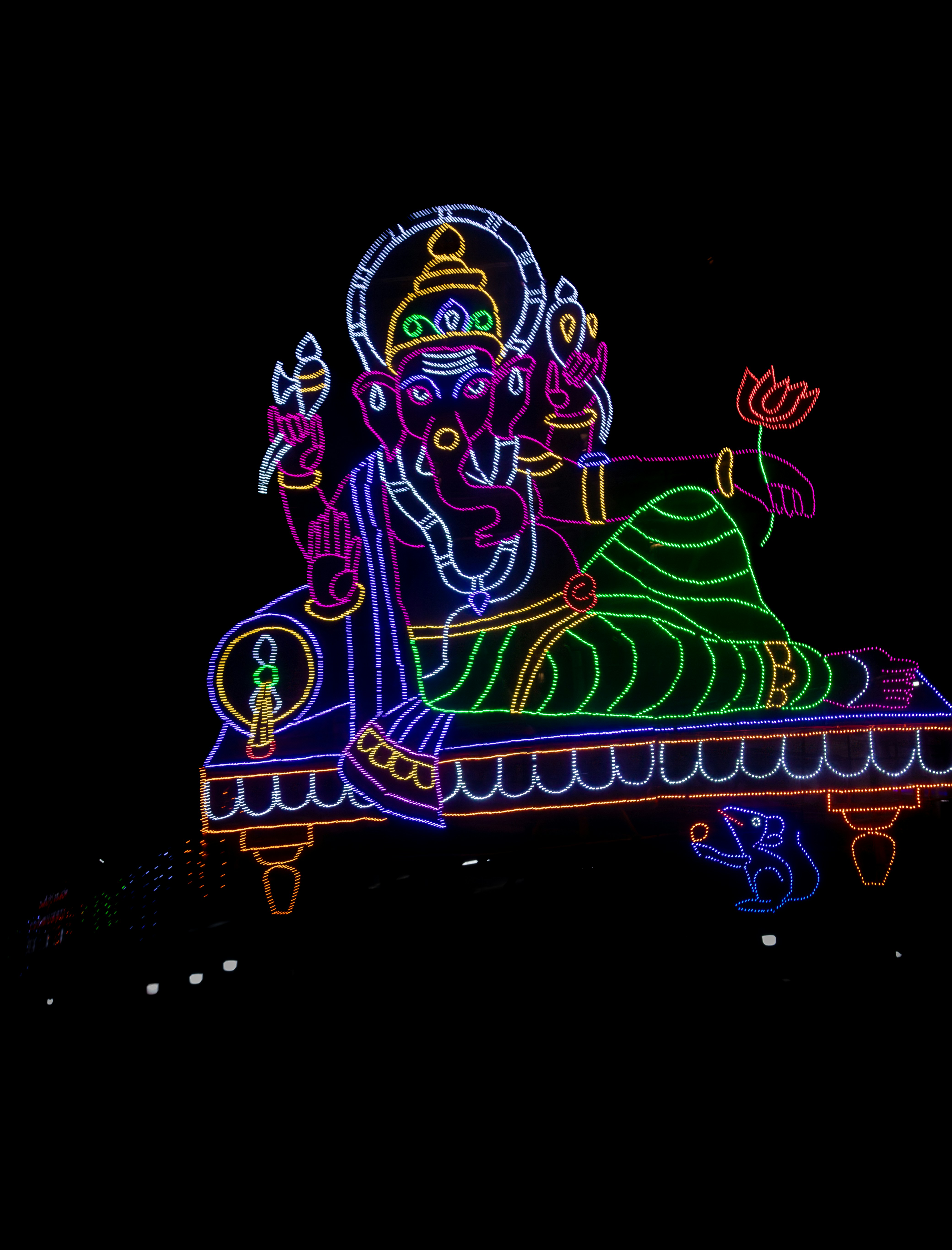 Neon Ganesha on a Midnight Pedestal: A Rainbow of Light