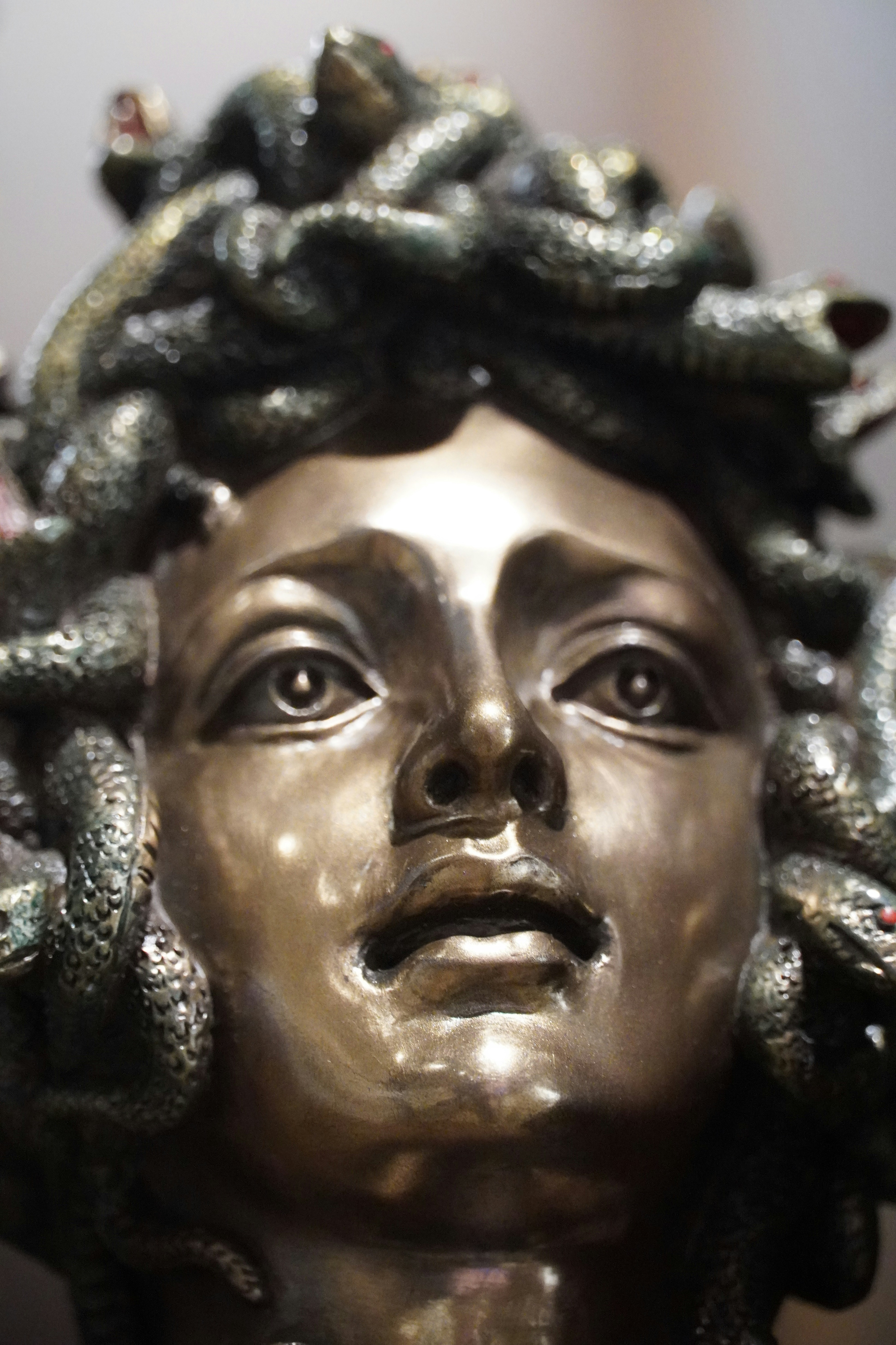 A close up of a statue of a woman with snakes on her head photo – Free ...