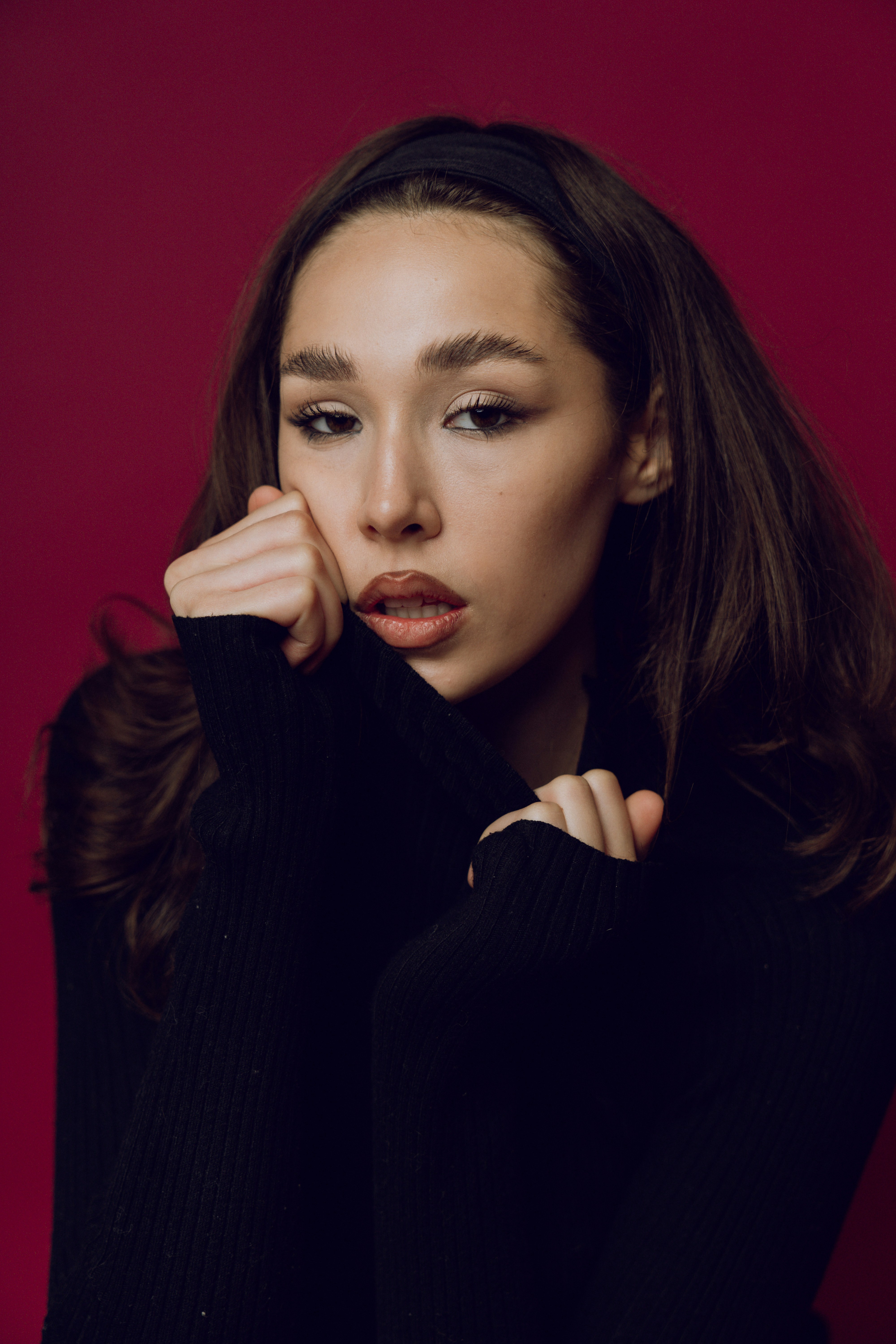 A woman posing with her hand on her chin photo – Free Woman Image on ...