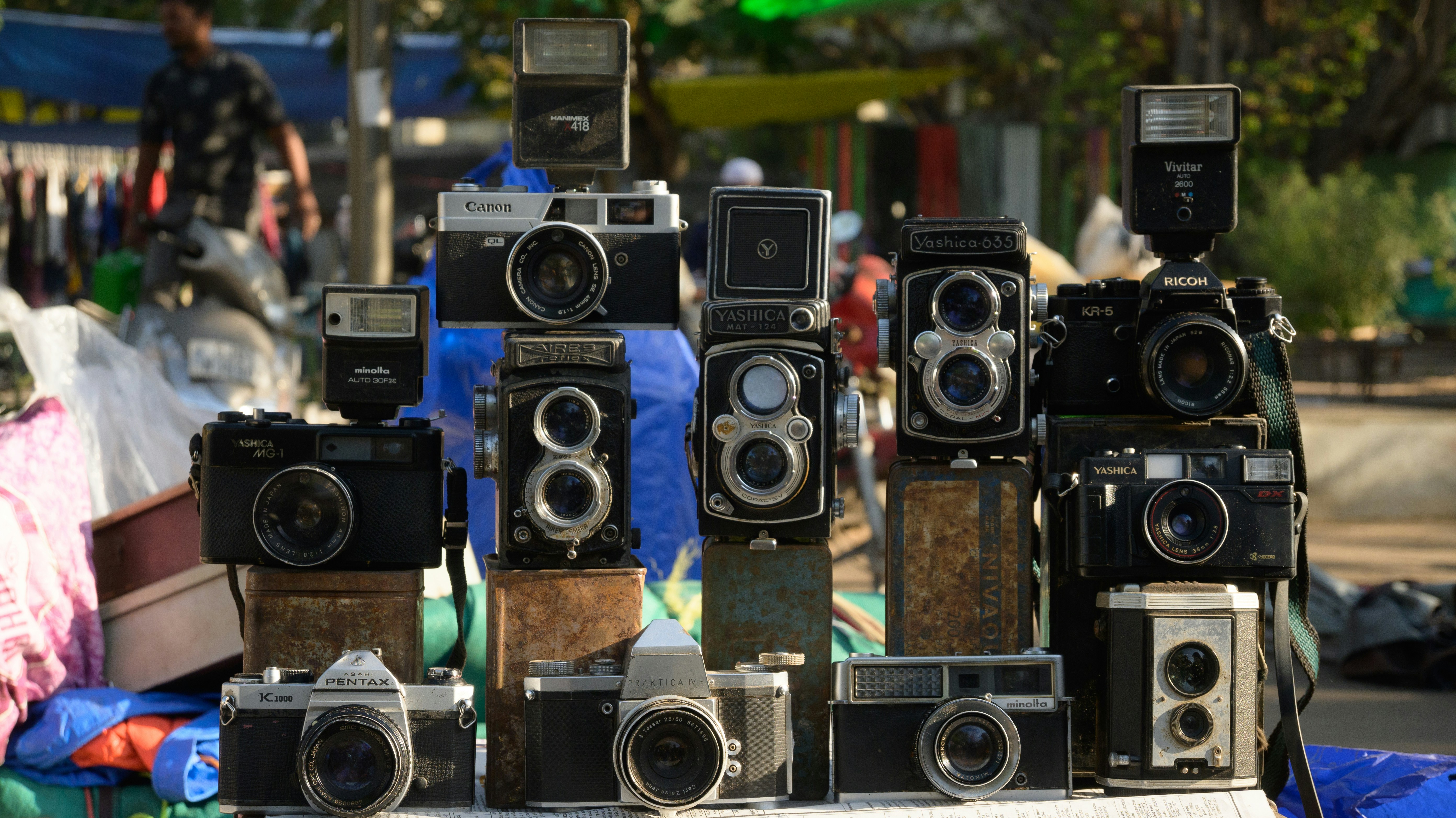 A pile of old cameras sitting on top of a table photo – Free Camera ...