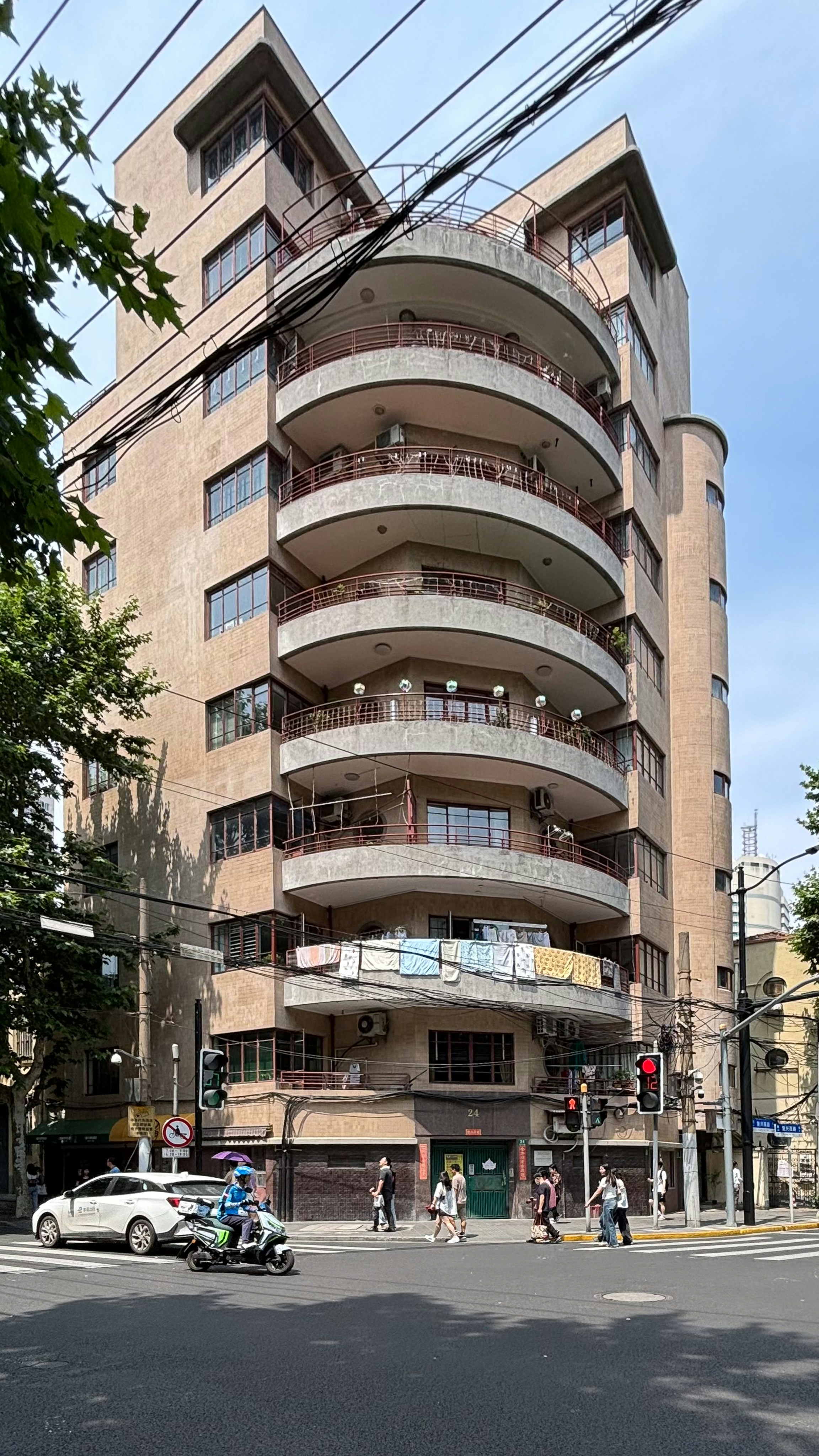 Curved Balconies in Concrete: A Busy Street Portrait