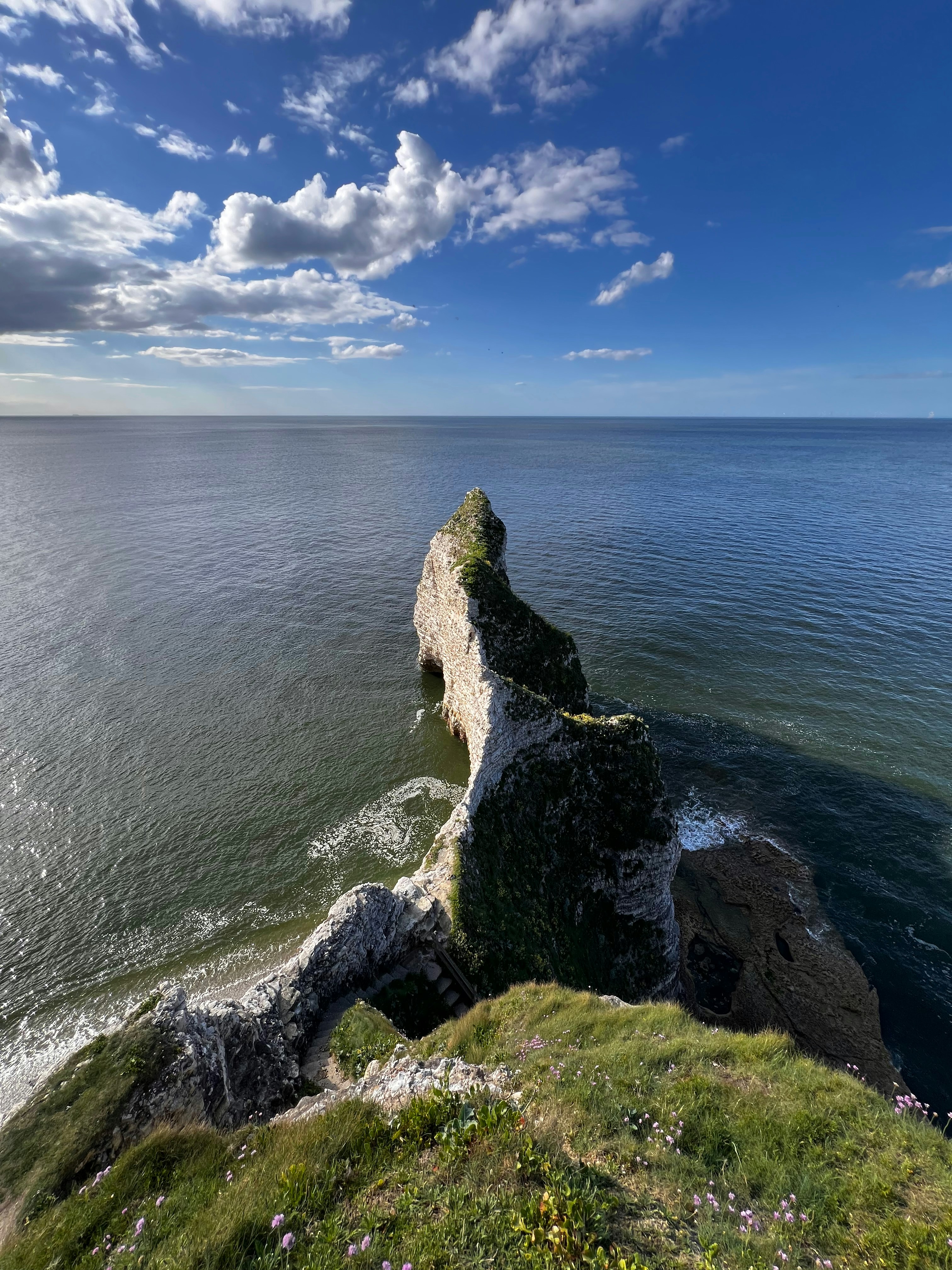 Spire of Stone Against the Sapphire Sea
