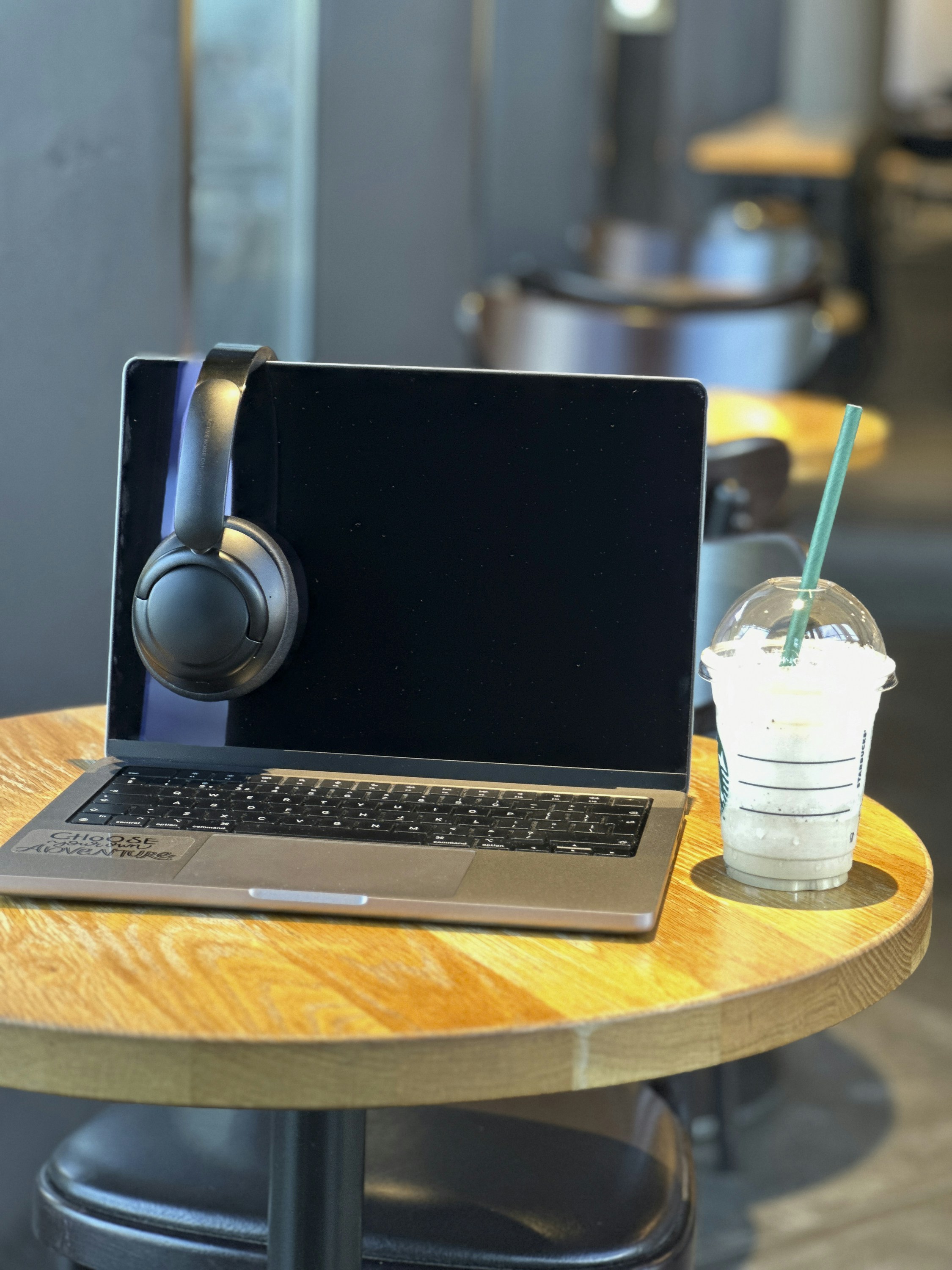 A laptop computer sitting on top of a wooden table photo – Free ...