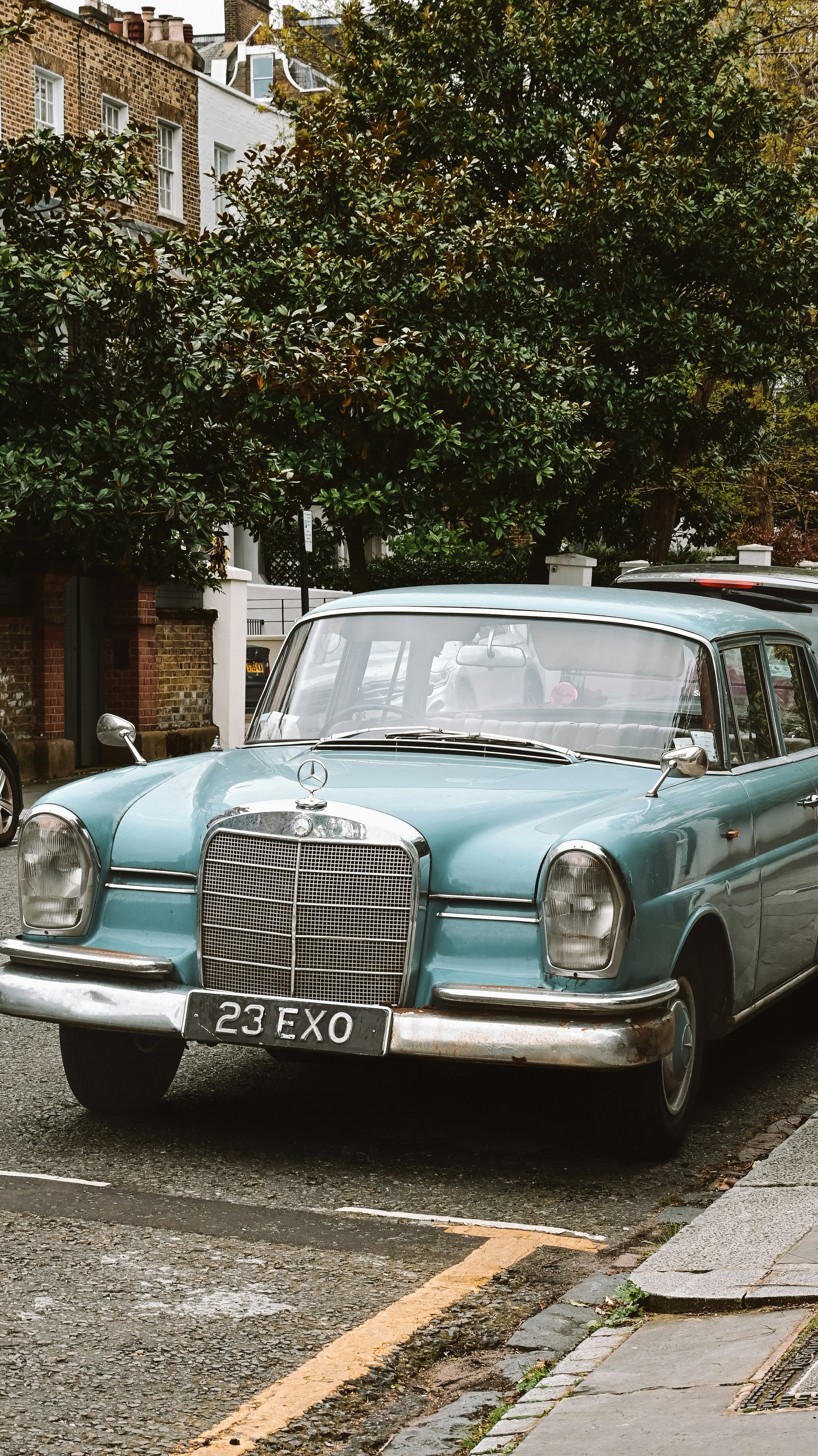 Azure Classic: A Vintage Mercedes Rests Under London Foliage