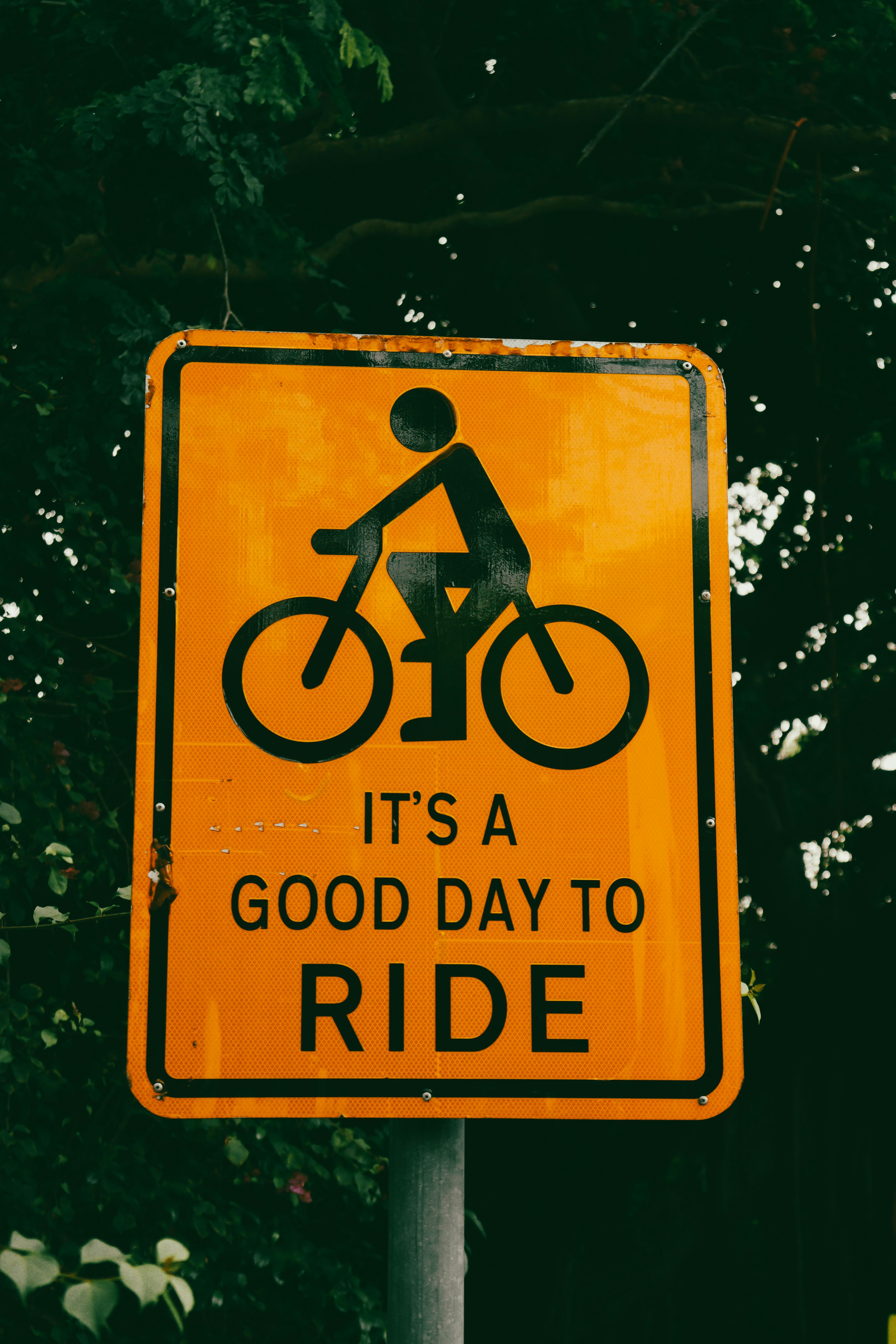 A yellow sign that says it's a good day to ride photo – Free Sign board ...