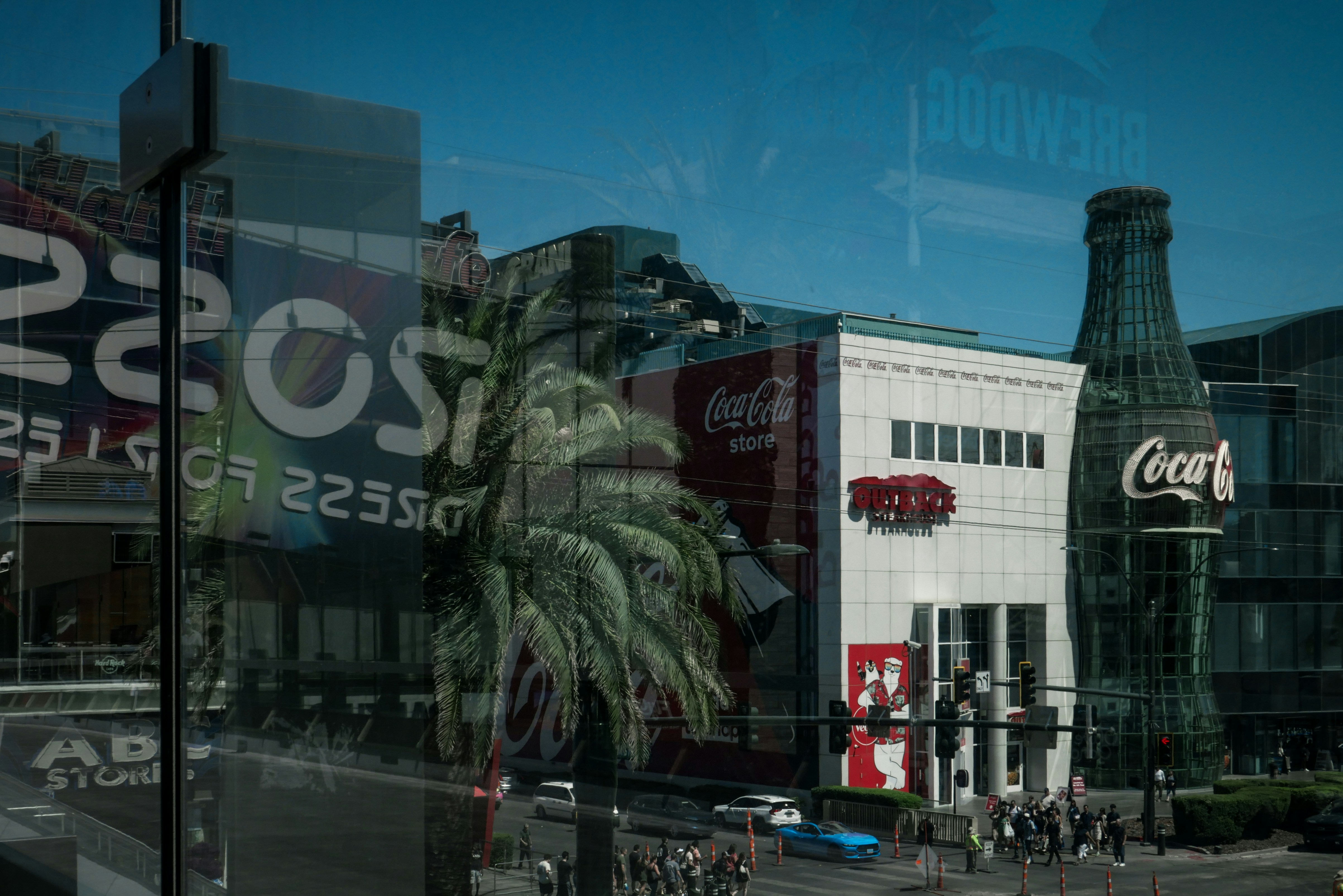 A reflection of a coca cola building in a window photo – Free Las vegas ...