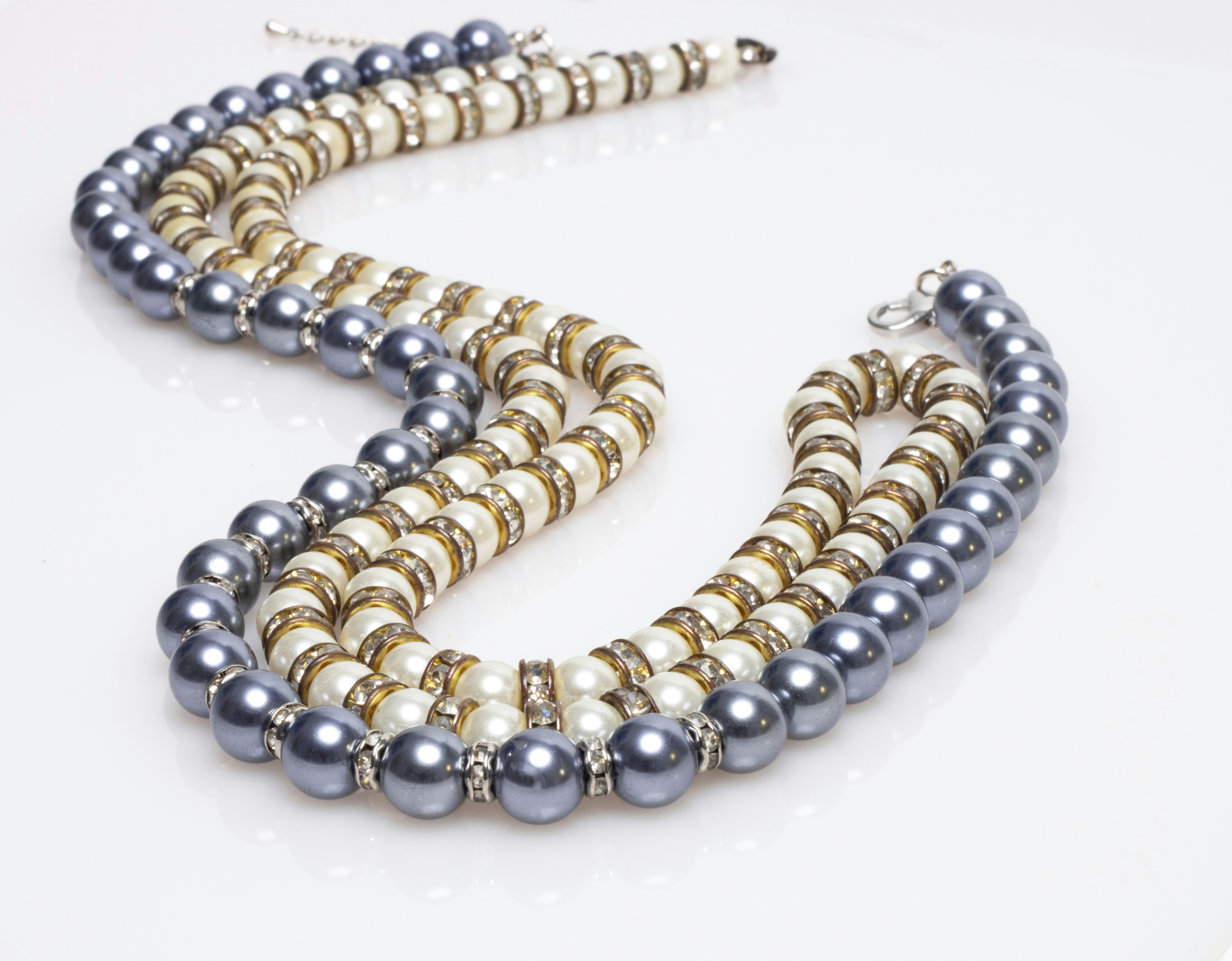 A multi stranded necklace with silver and gold beads photo – Free ...
