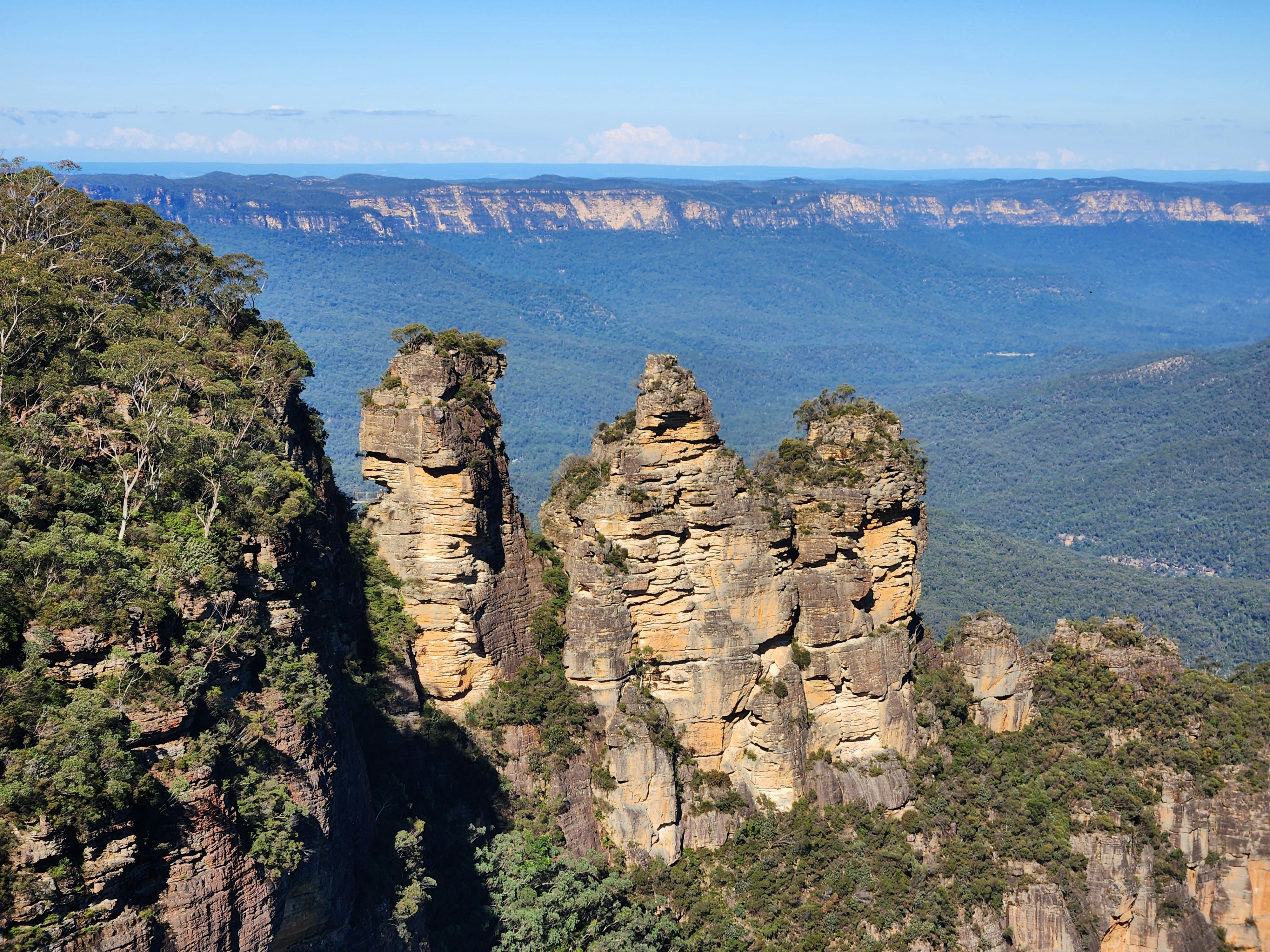 Three rock formations in the middle of a mountain range photo – Free ...
