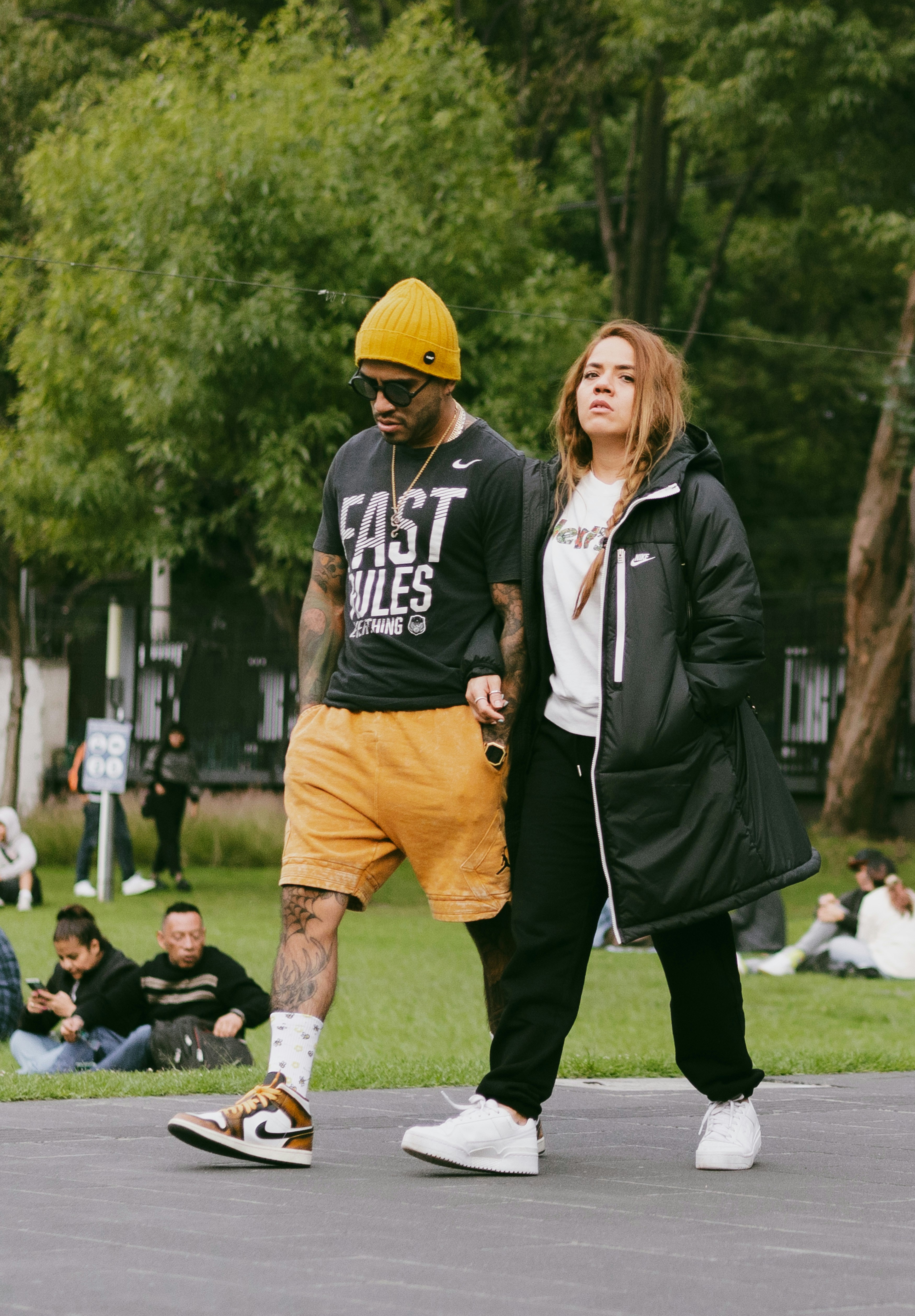 Two Walkers Side by Side: Street Style in a Park Moment