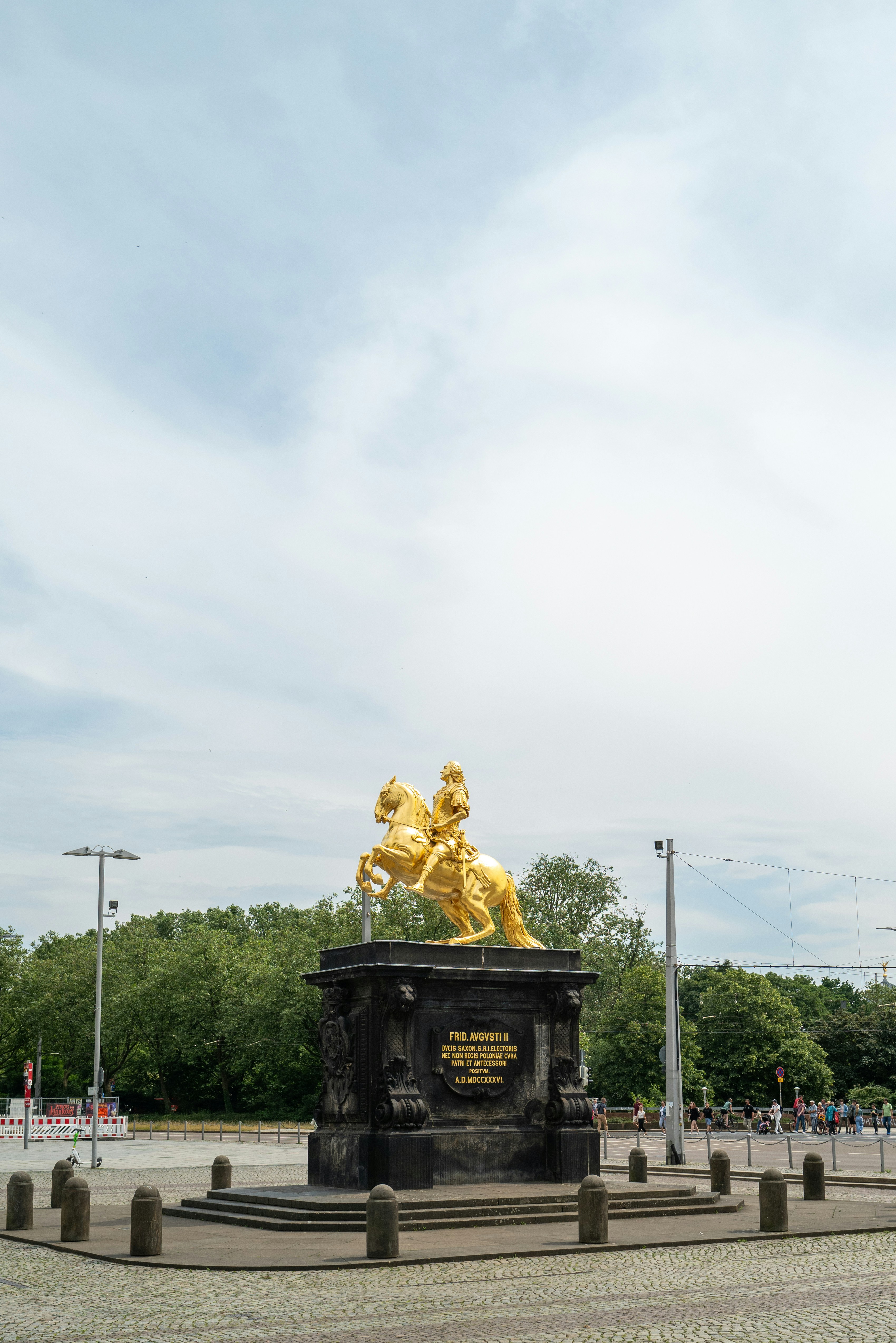 Gilded Cavalier in a Sunlit City Square