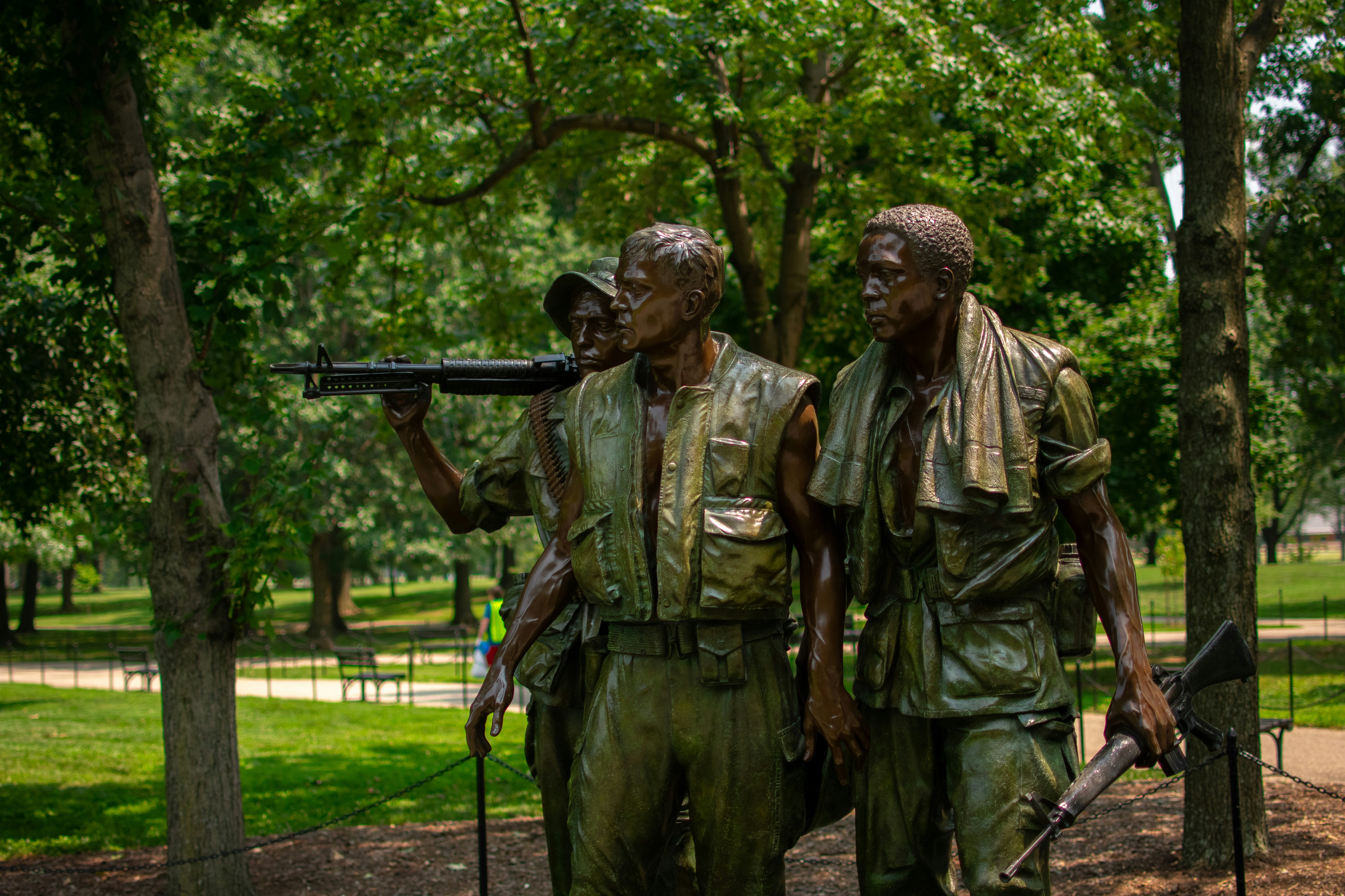 A couple of statues of men holding guns photo – Free Camera Image on ...